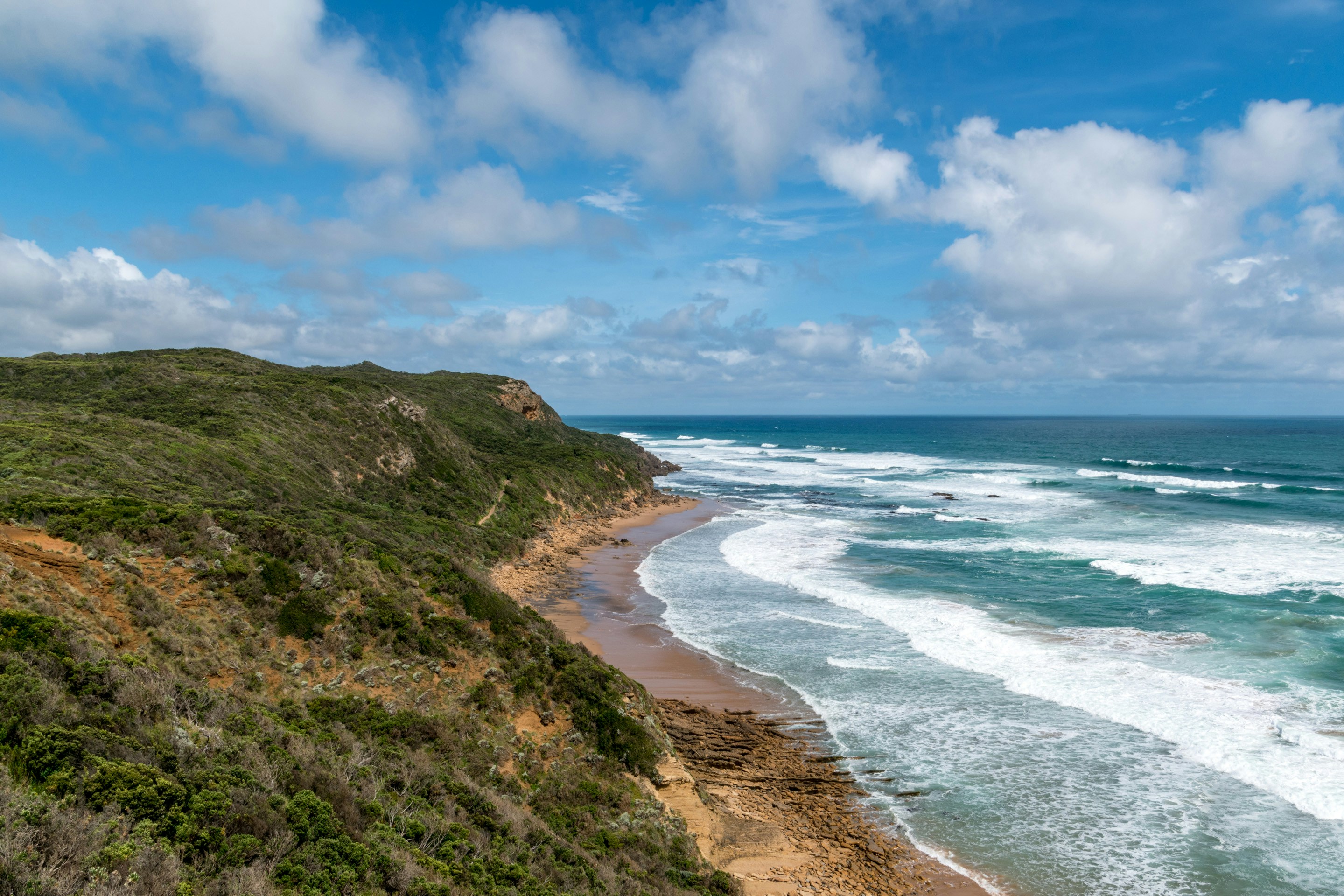 Green grass field near sea under blue sky during daytime photo – Free ...