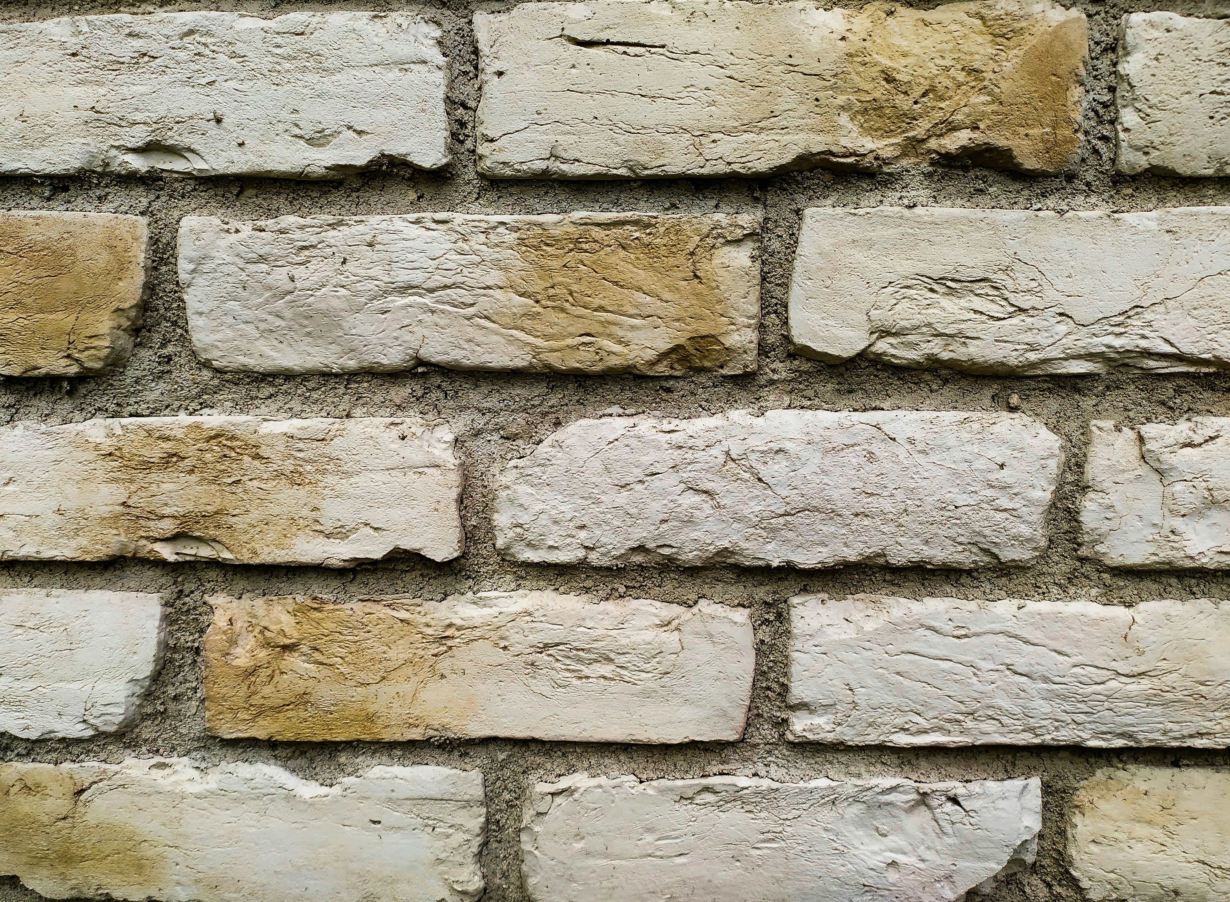 Weathered Lines: Close-Up of Aged Brick Texture