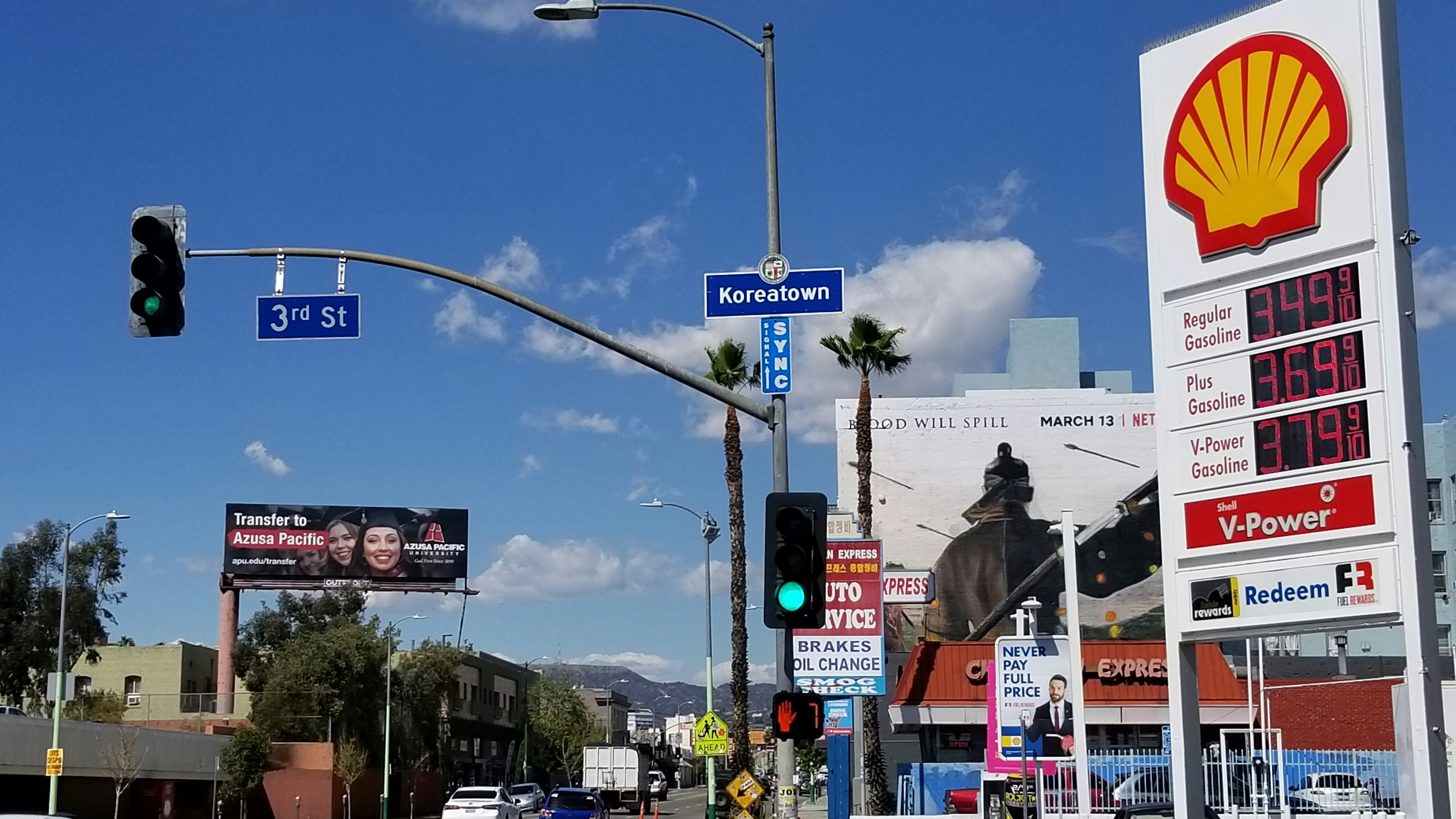 Crossroads and Neon Shell: A Sunny Downtown Stop