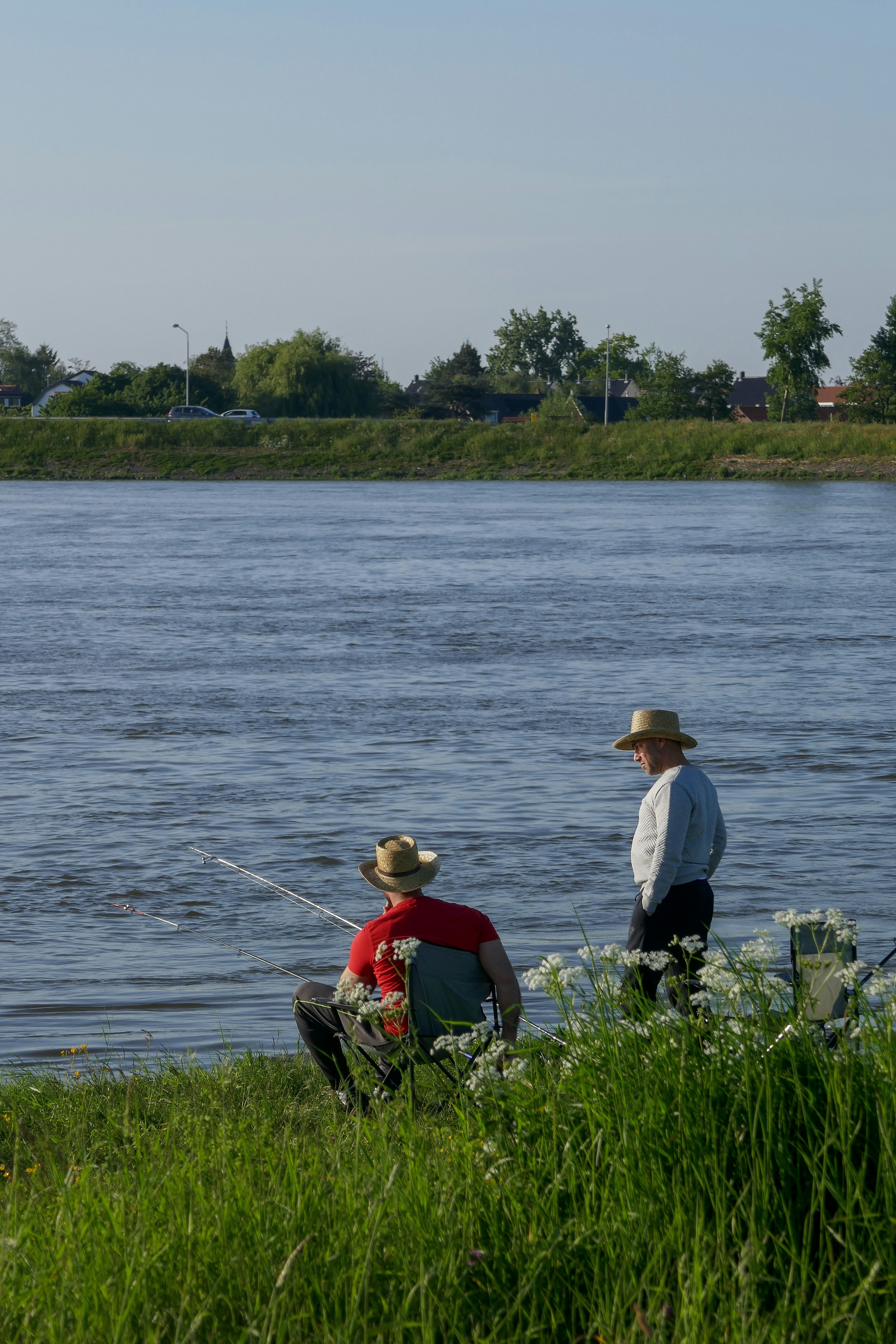 2 men fishing on lake during daytime photo – Free Ridderkerk Image on ...