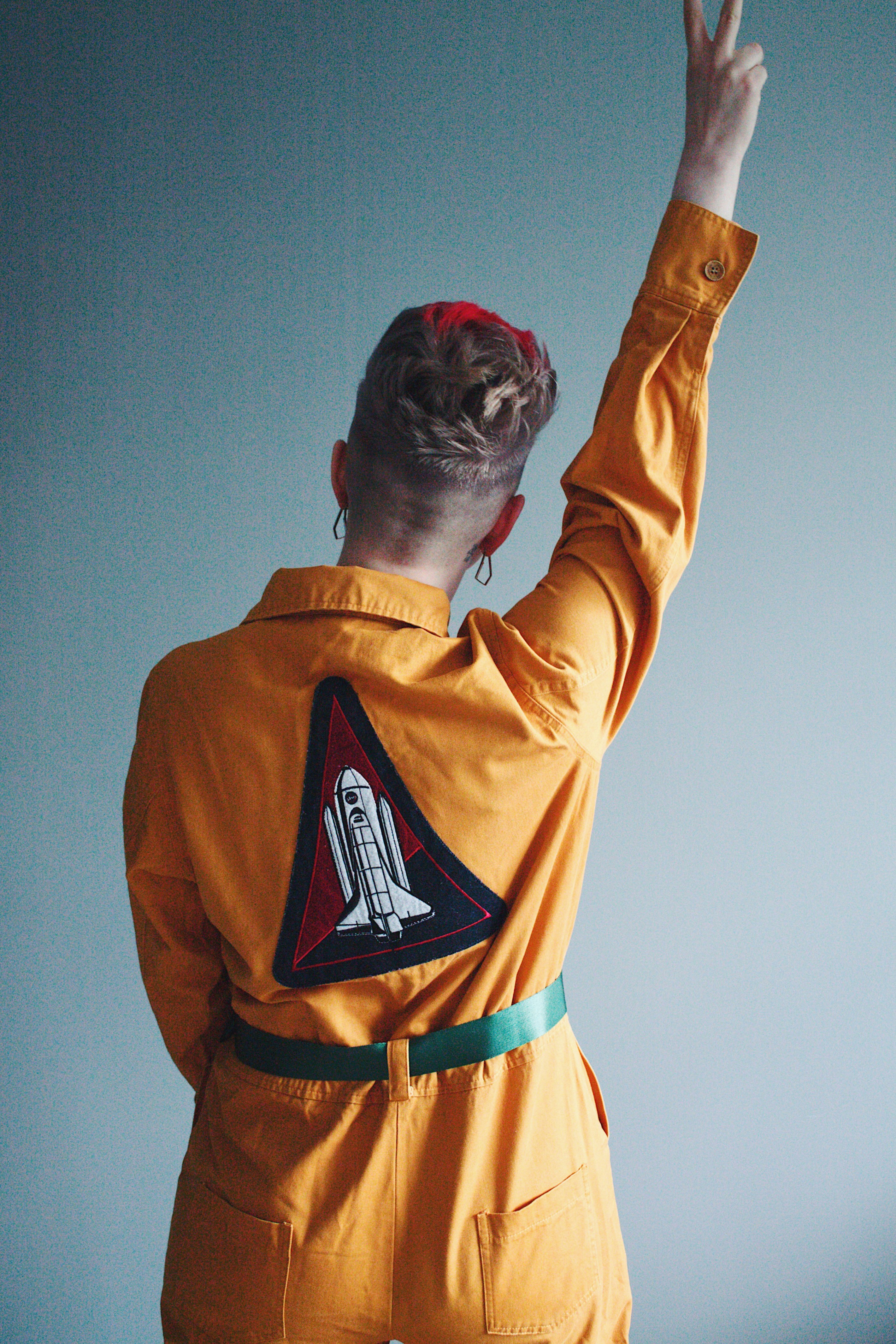 Raising a Rocket: Orange Jumpsuit with a Back Patch