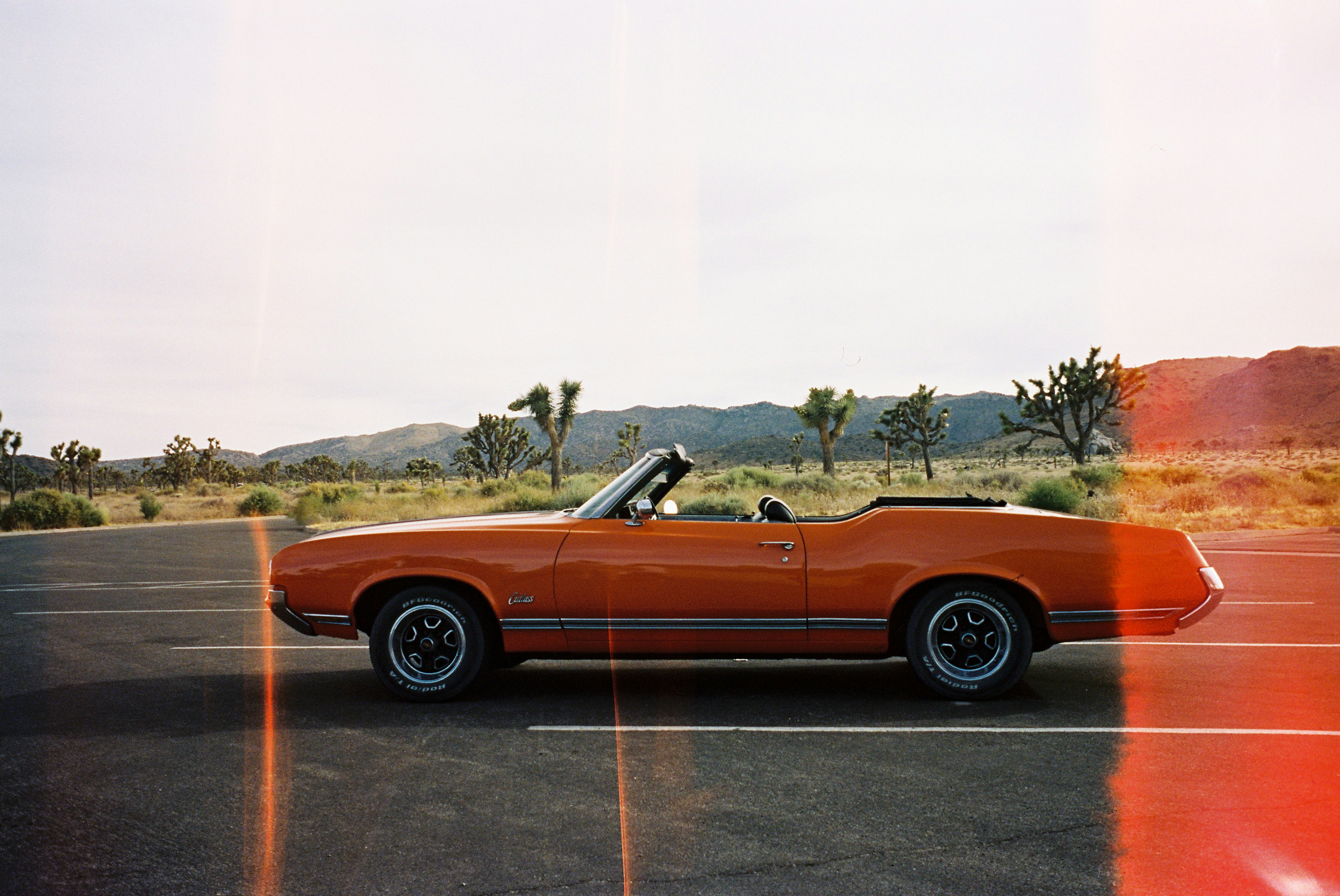 Orange convertible car on gray asphalt road during daytime photo – Free ...
