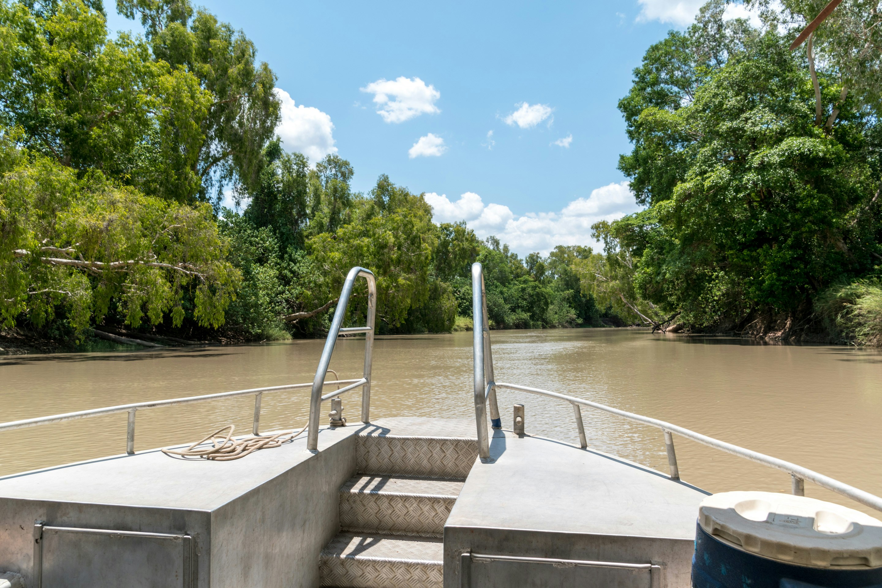 Bow Toward the Quiet River: A Sunlit Deck Perspective