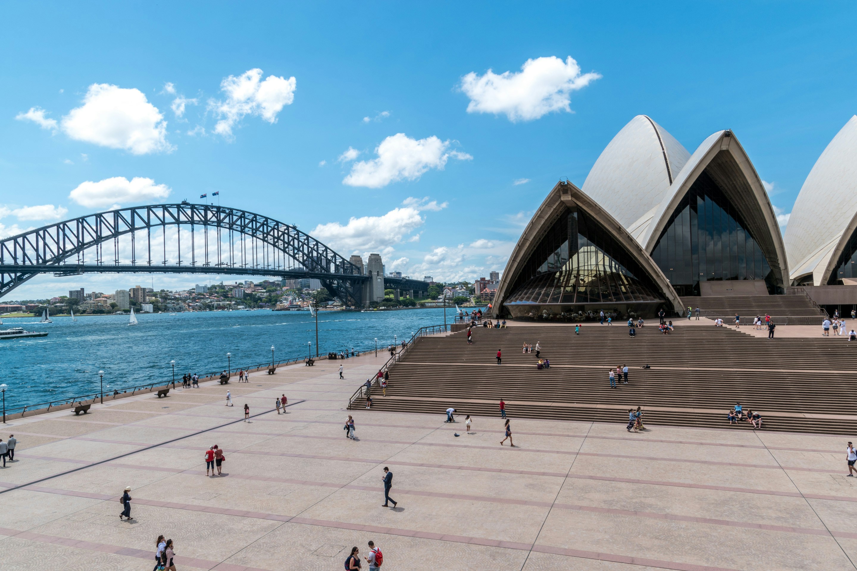 People walking on beach near sydney opera house during daytime photo ...