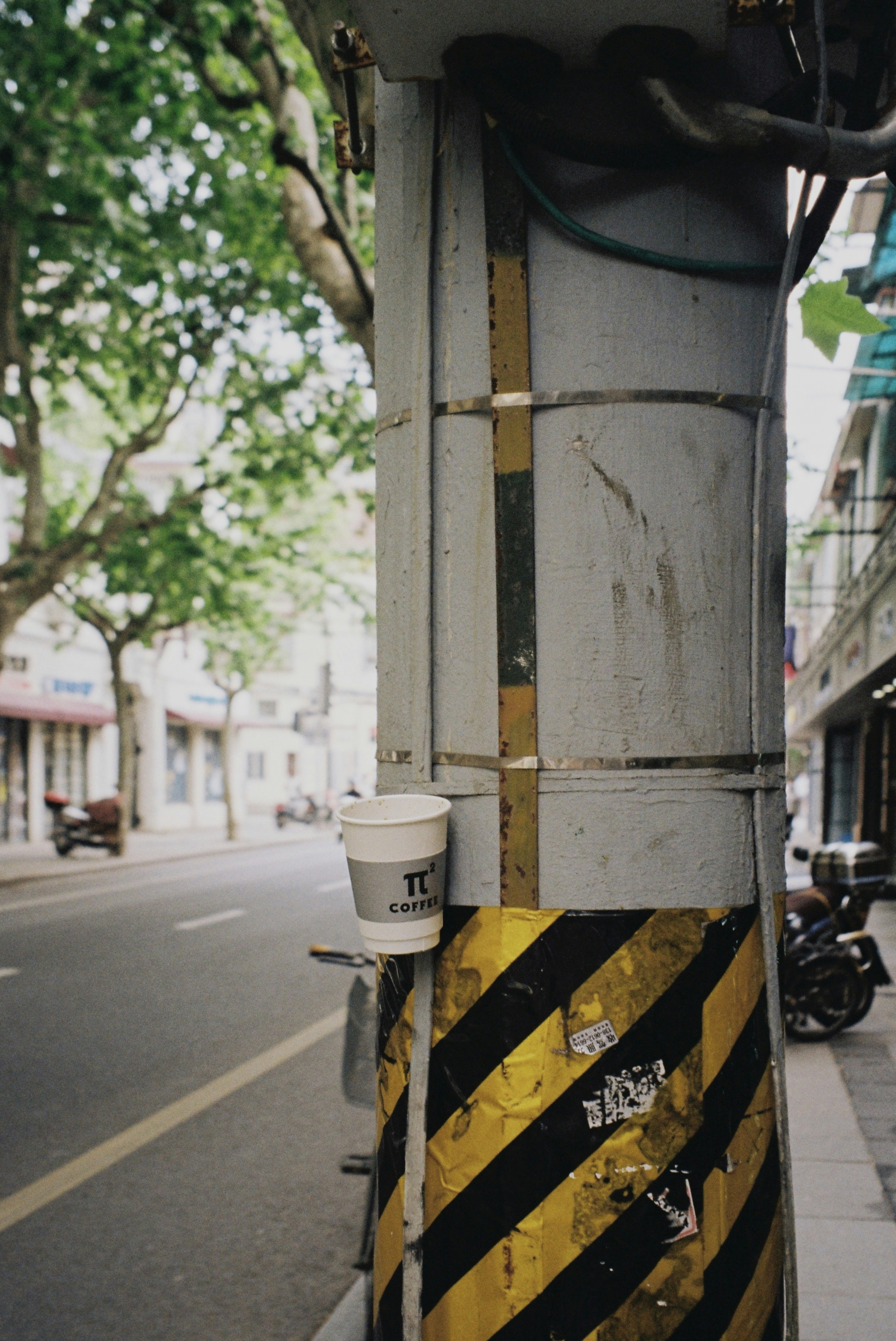 White and black trash bin beside gray concrete post photo – Free ...