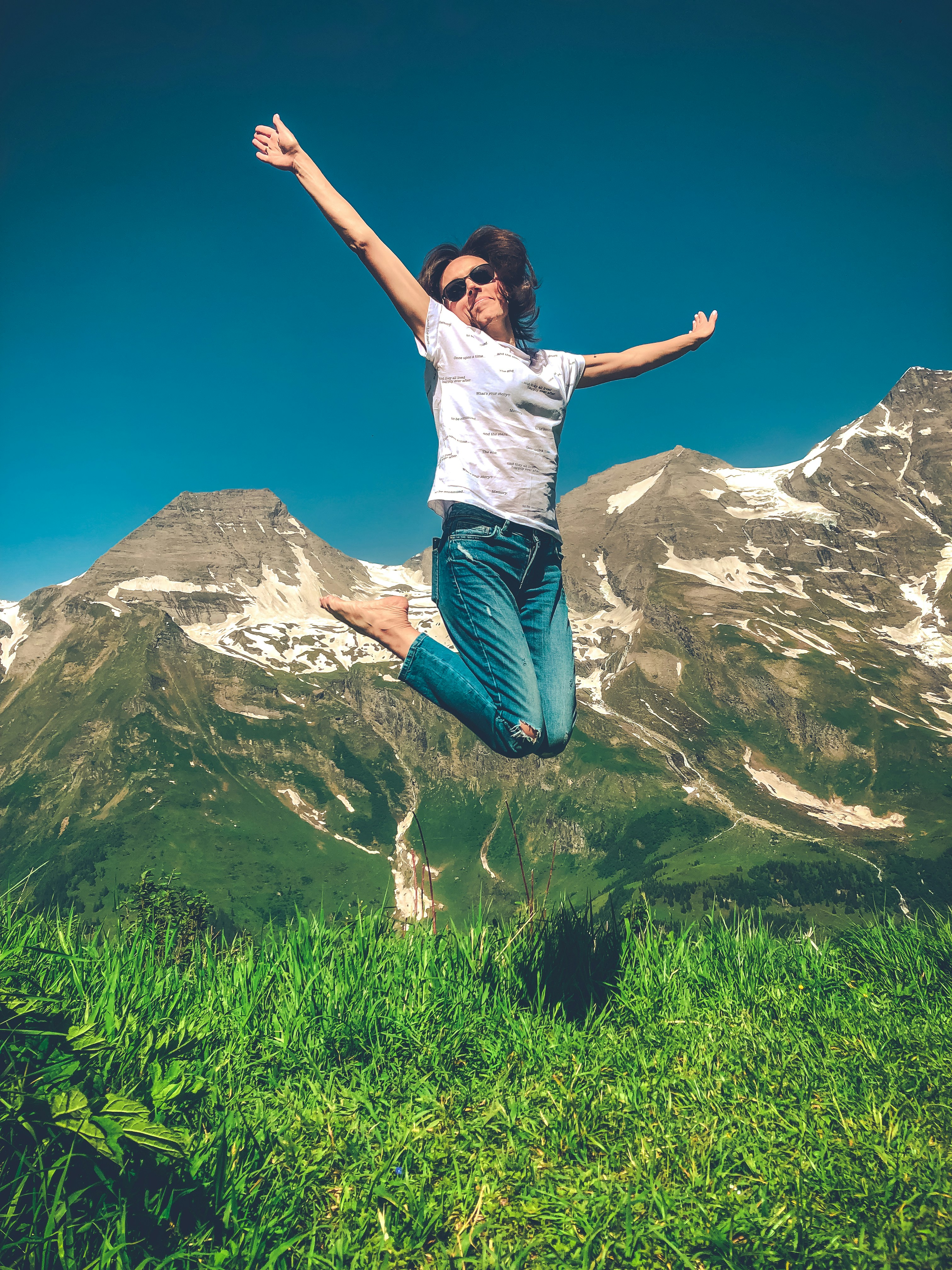High Alpine Jump: A Sunlit Moment Above Green Slopes