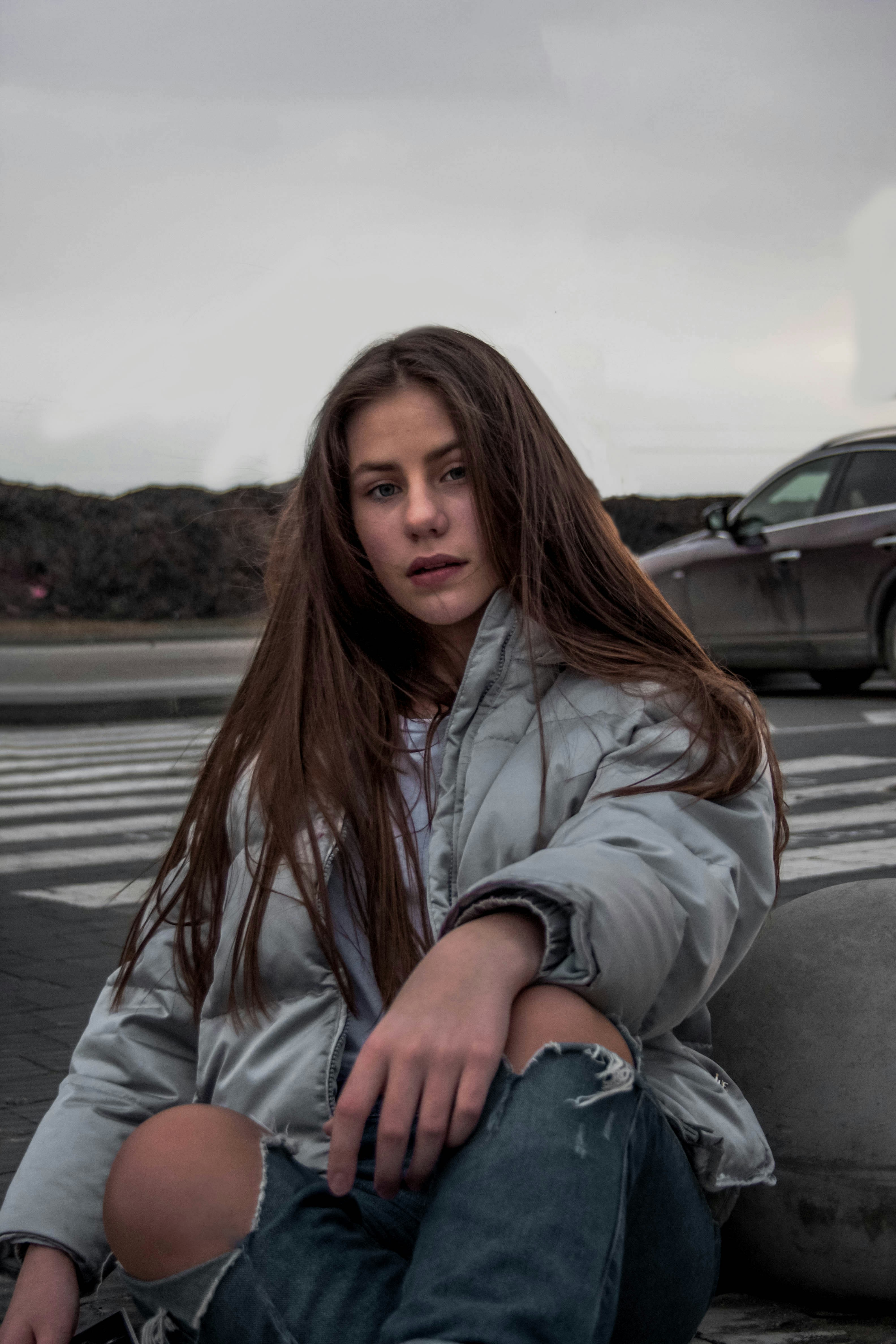 Stormy Horizons: A Quiet Moment with a Street-Clothed Portrait