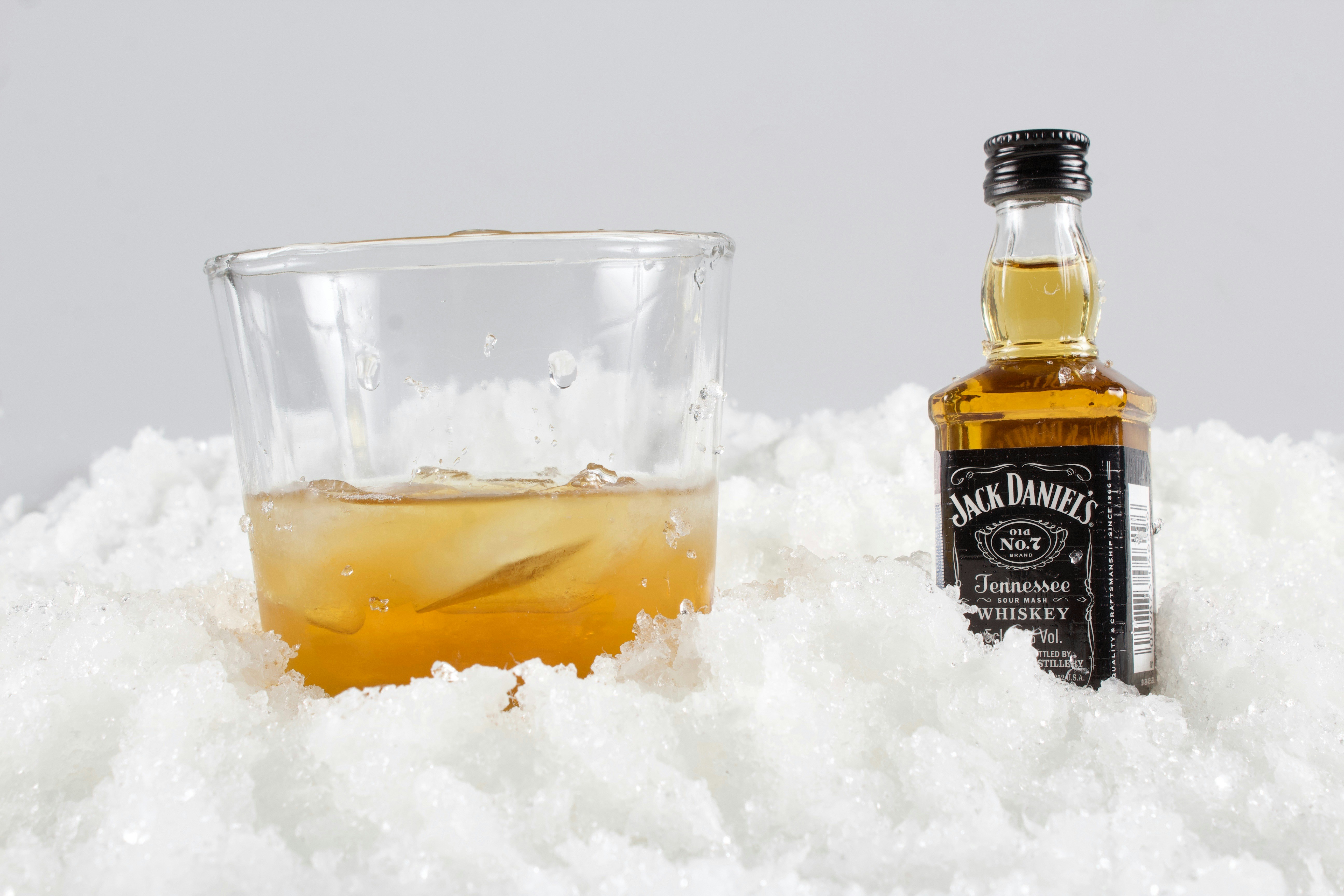 Whiskey on Ice: A Glass Nestled in Frosty Snow