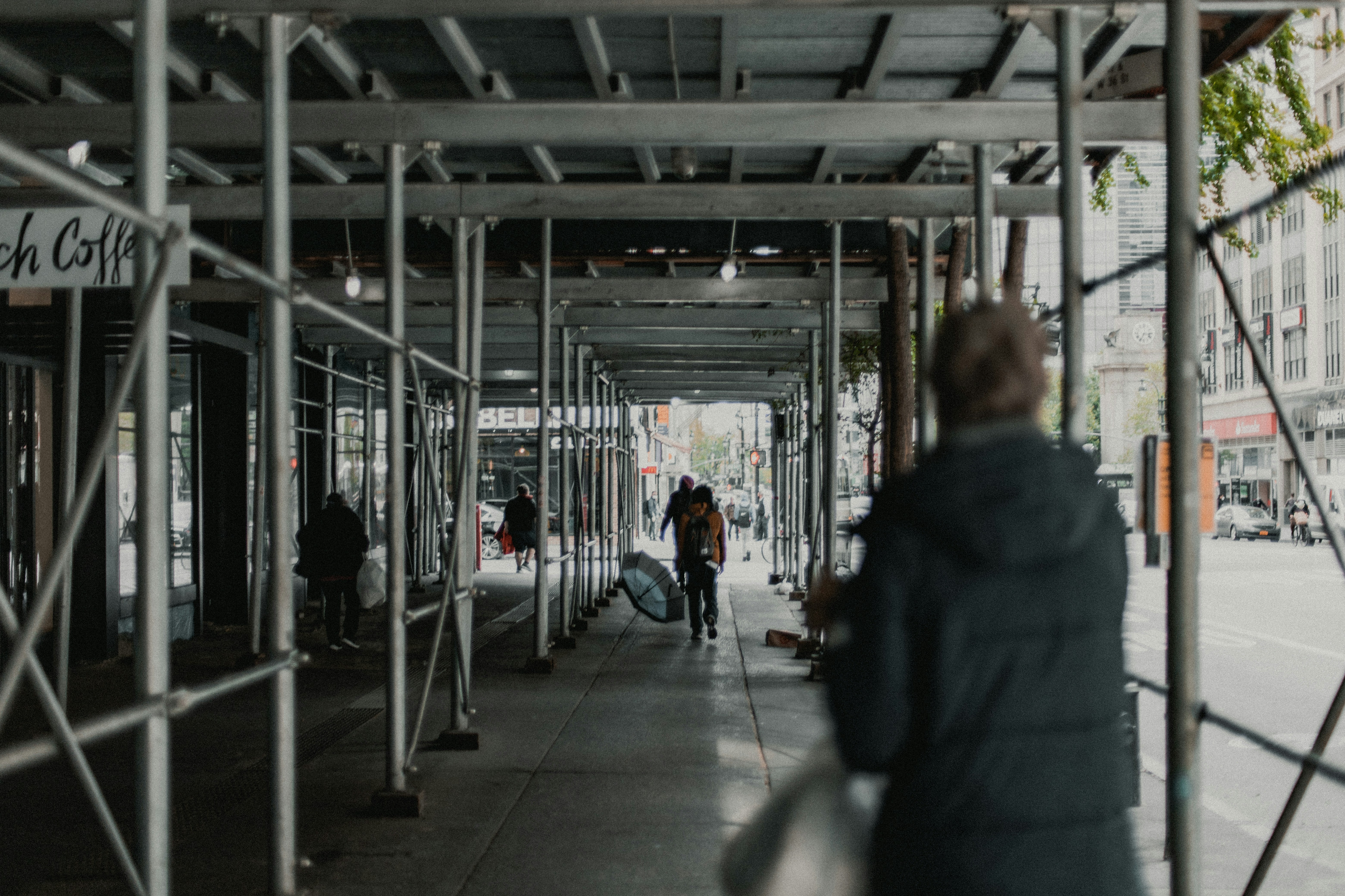 Under the Grid: Quiet Walk Through a City Scaffold