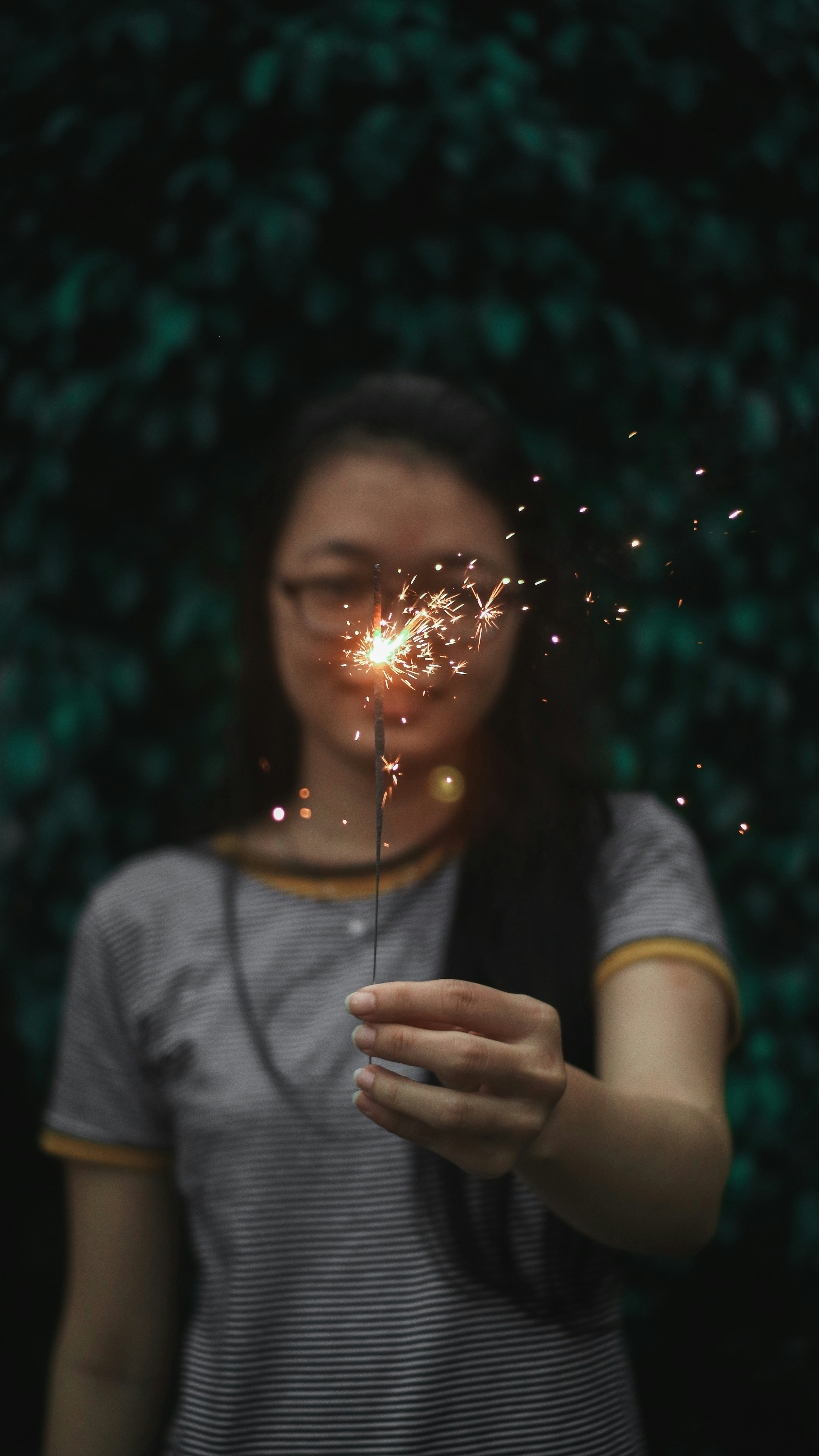 Whisper of Sparks: A Portrait Framed by Firelight