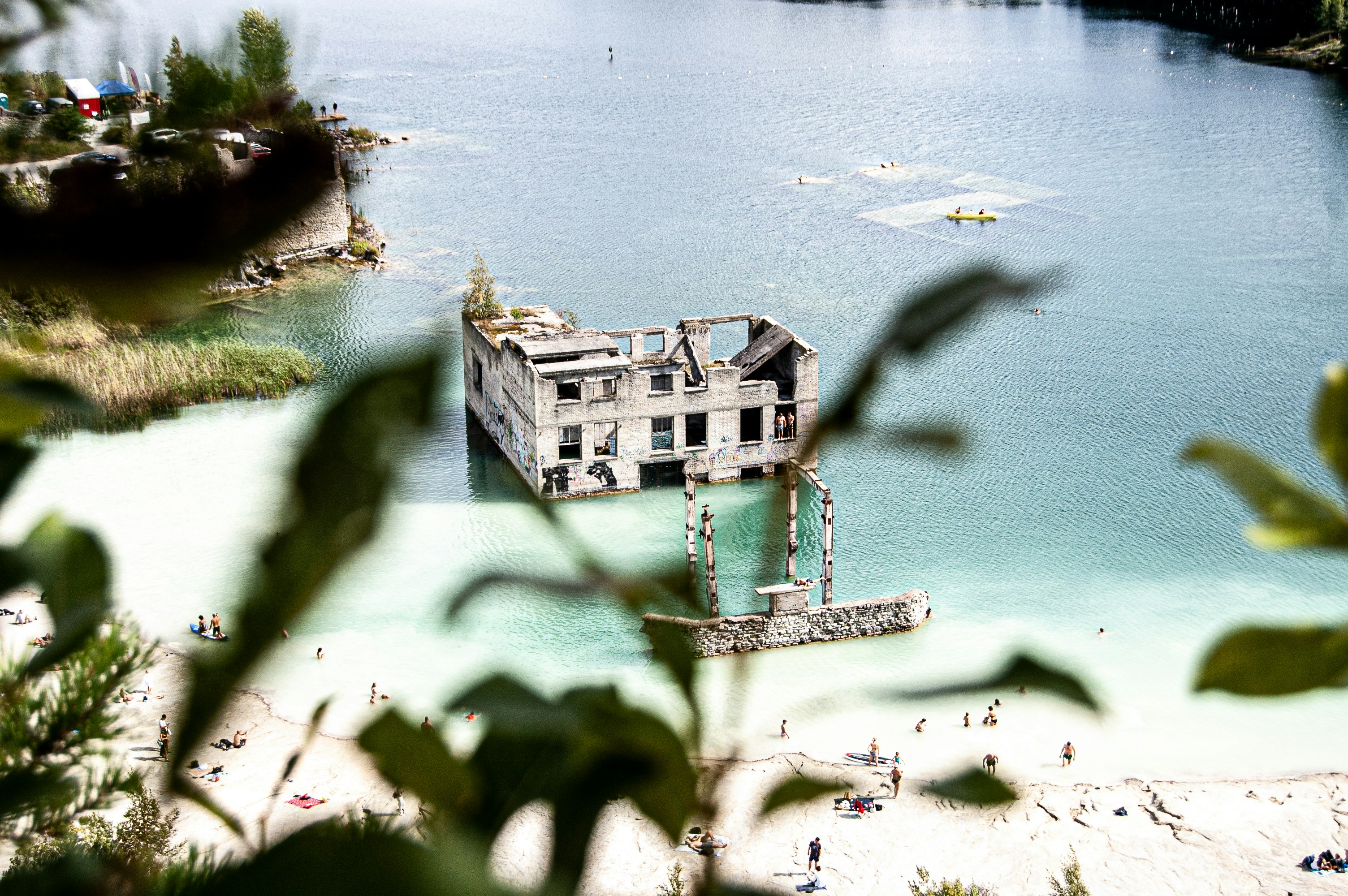 Abandoned Concrete House on Stilts in a Turquoise Cove