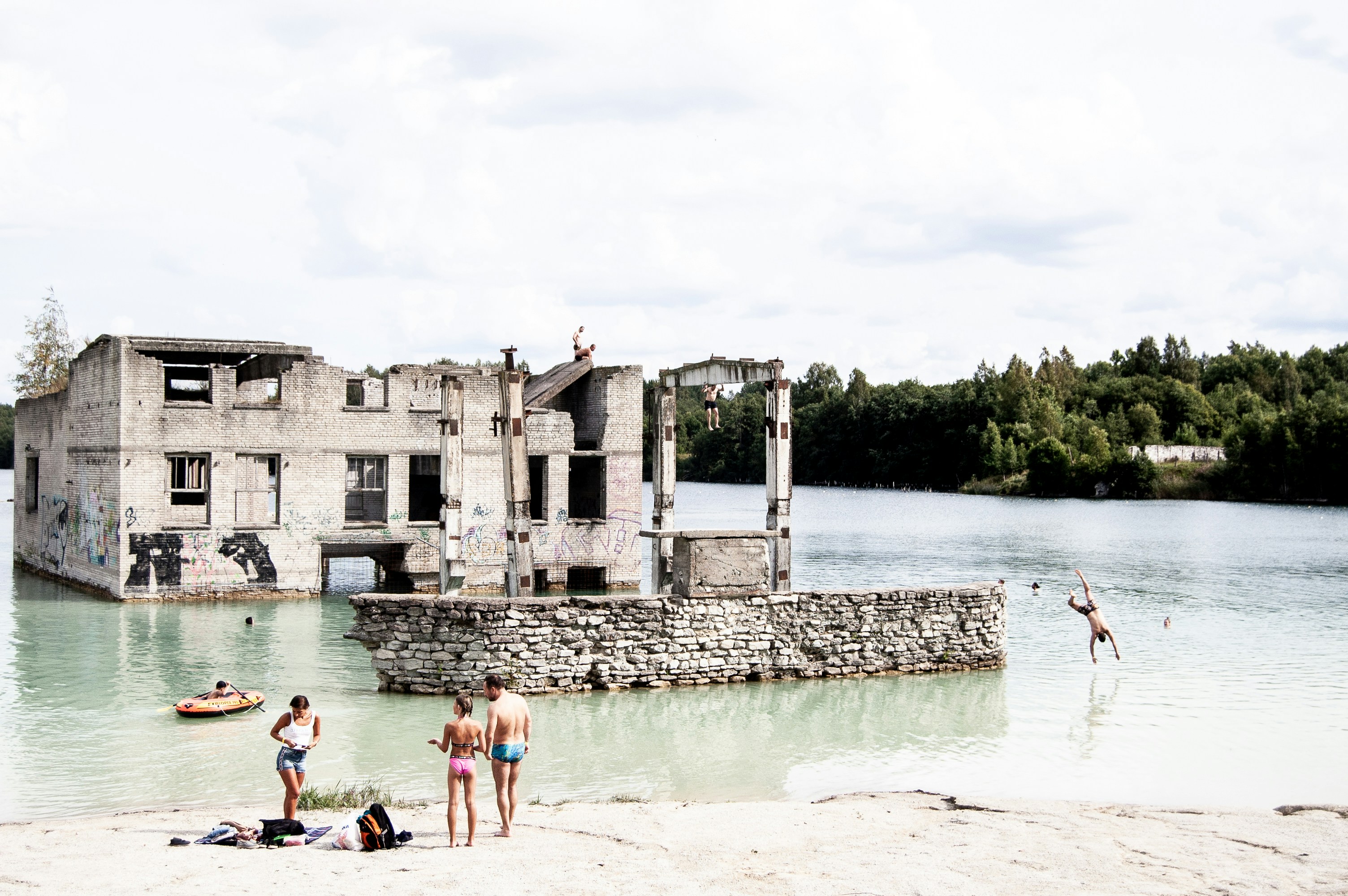 Turquoise Water and a Crumbling Waterfront: A Quiet Lakefront Beach Scene