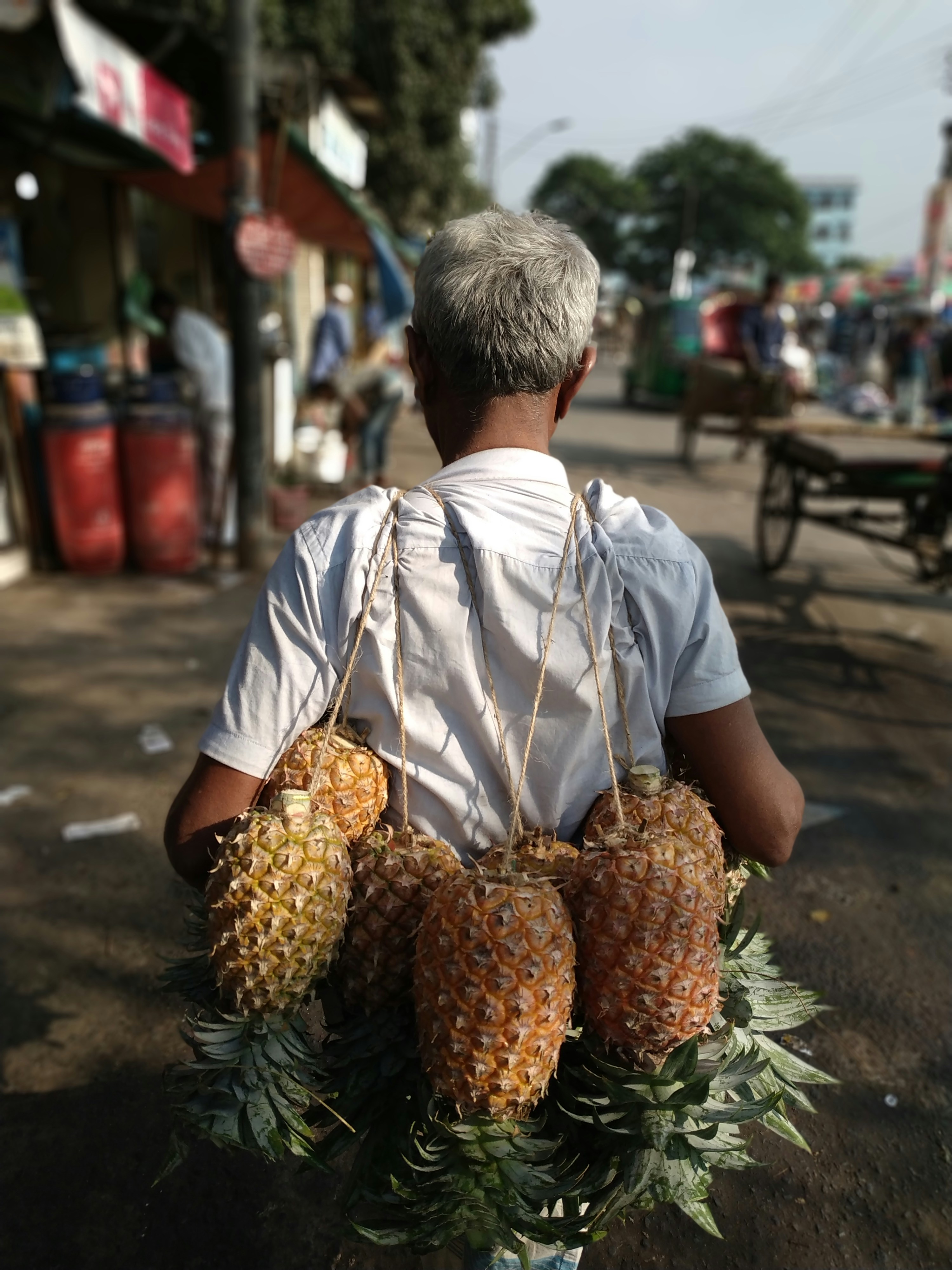 Pineapple Pack on a Busy Street: A Market Moment