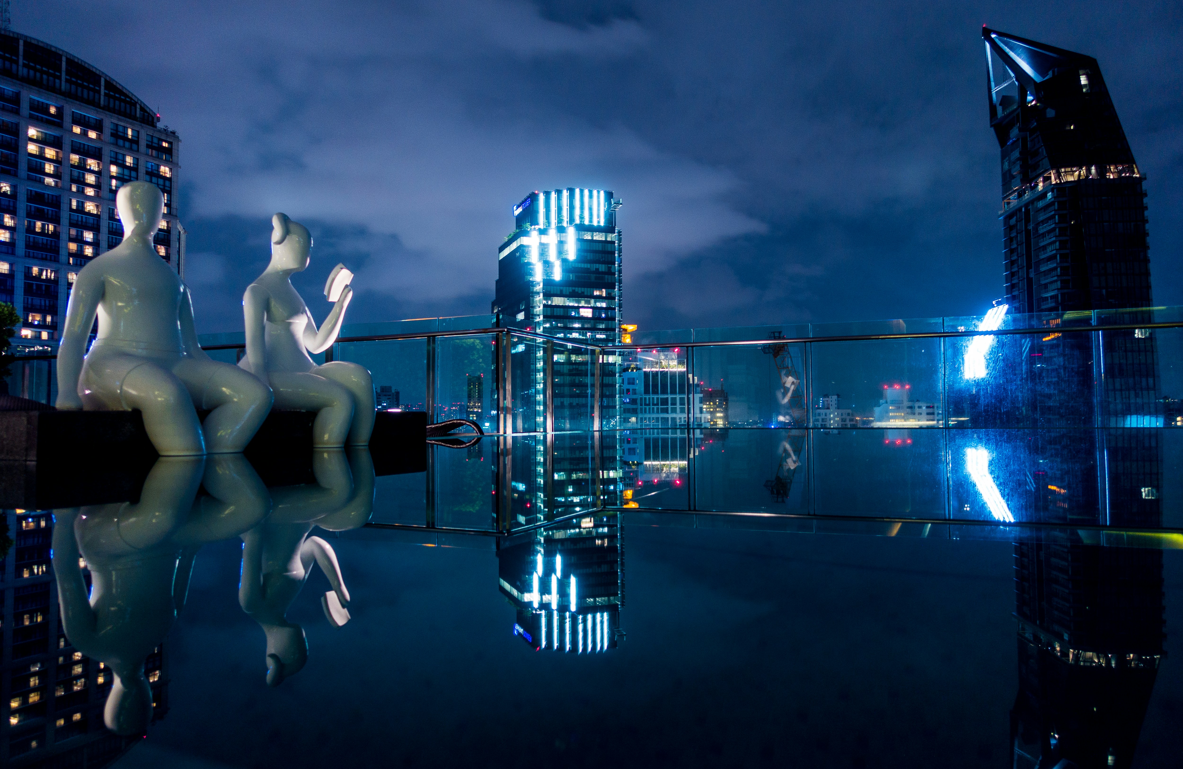 Blue City Reflections at the Rooftop Edge