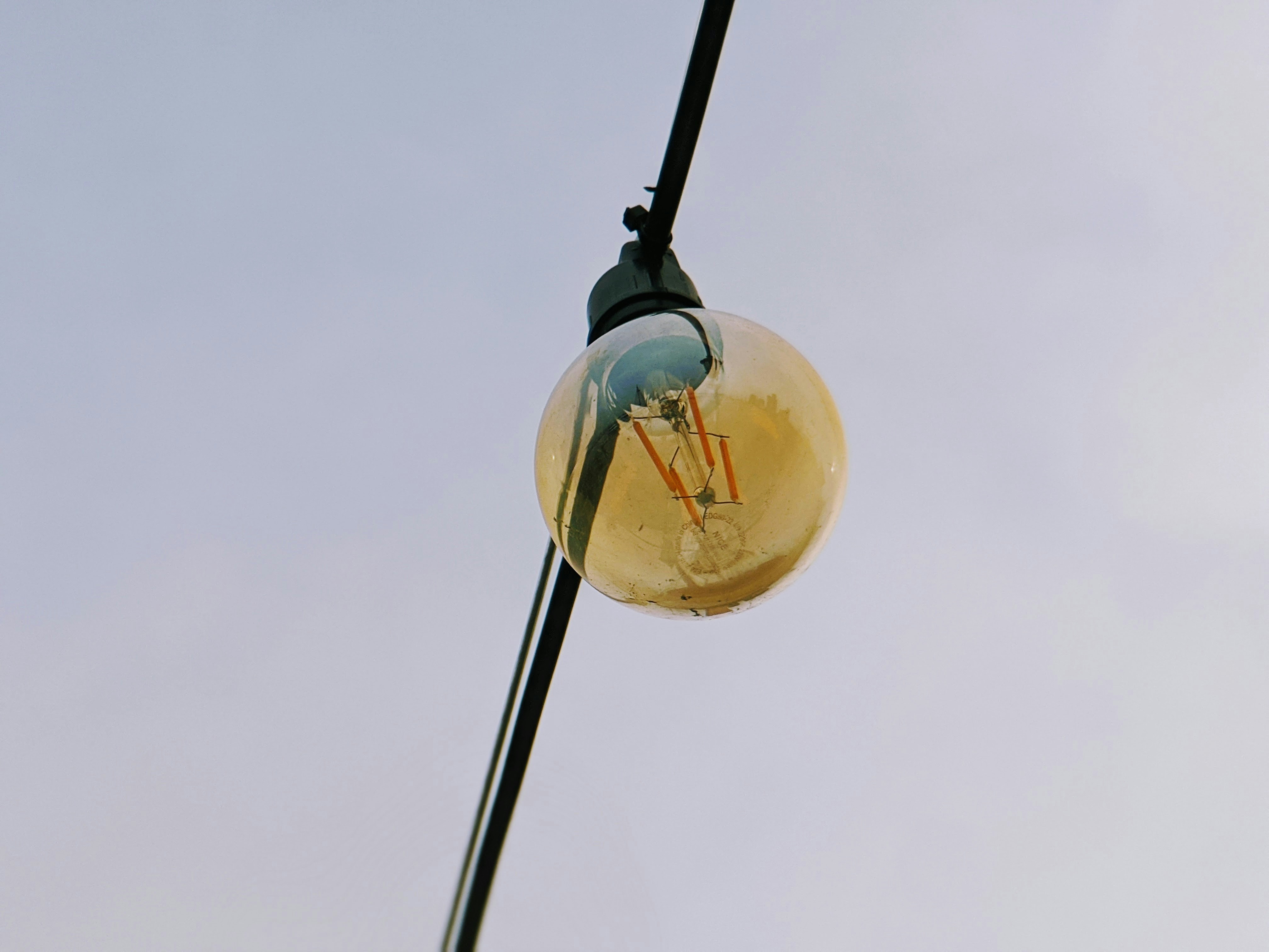 Hanging Globe, Quiet Sky: A Minimal Moment of Light