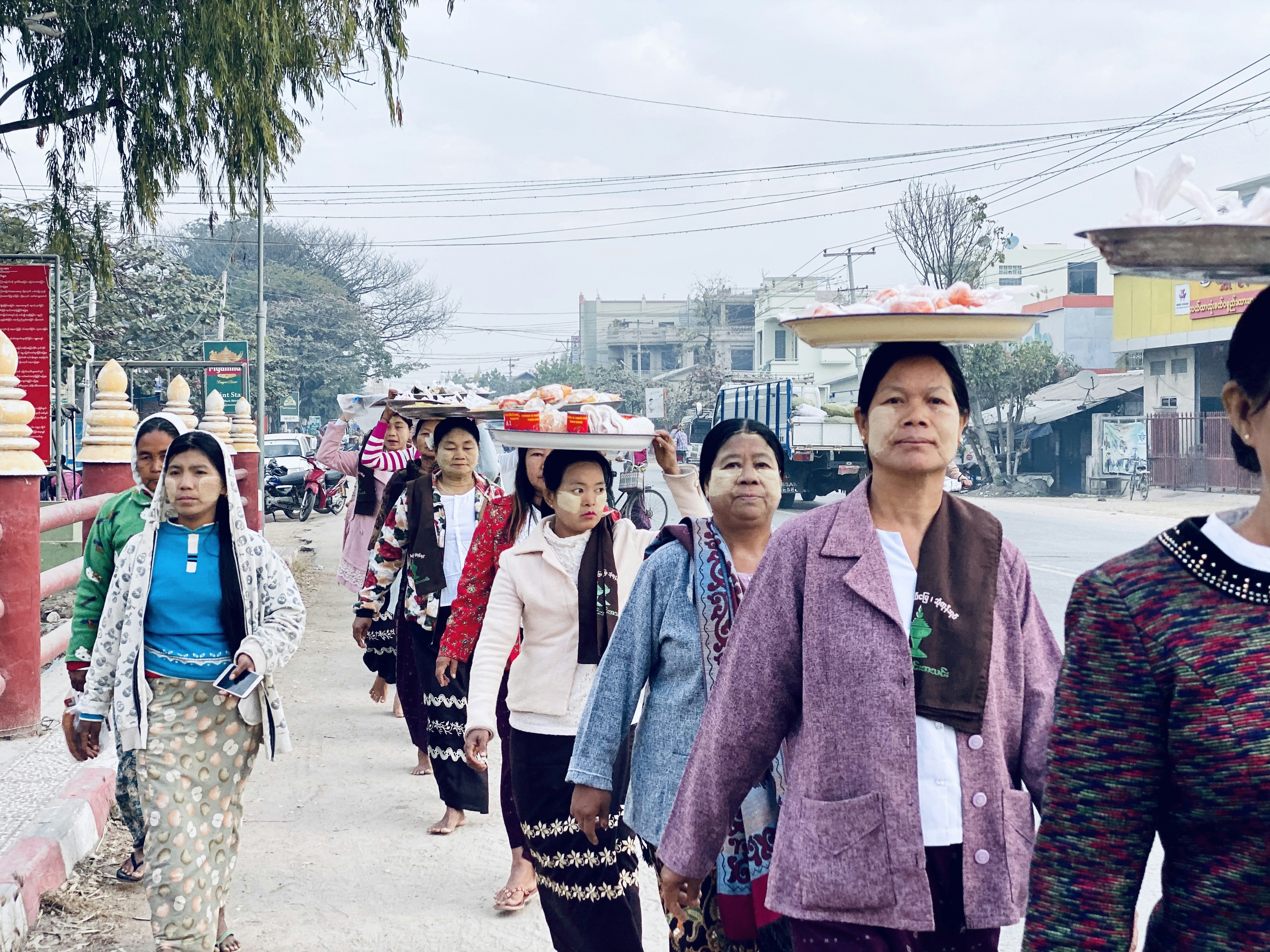 Woman in pink robe standing near people during daytime photo – Free ...