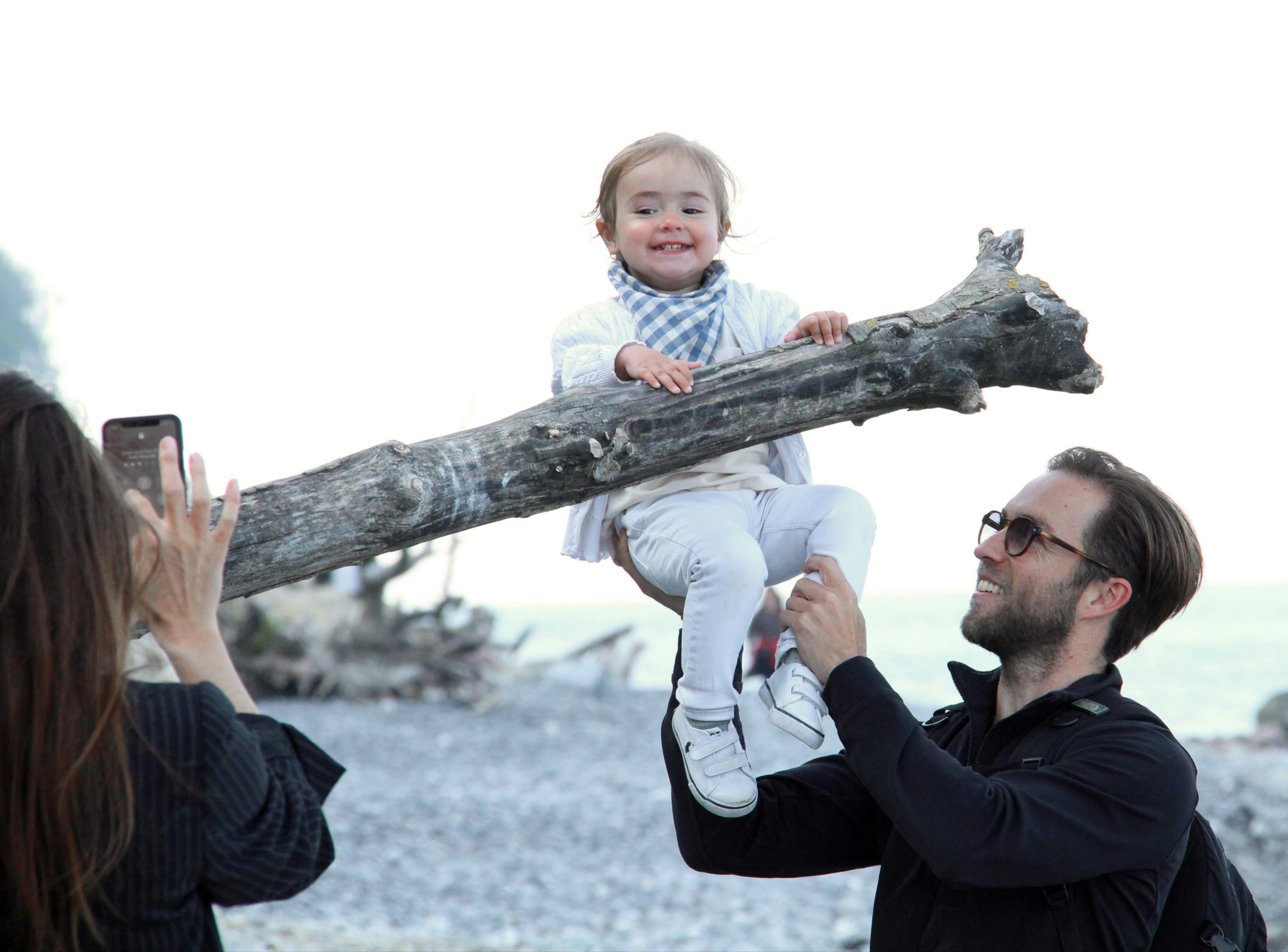 Joyful Balancing Act by the Shore