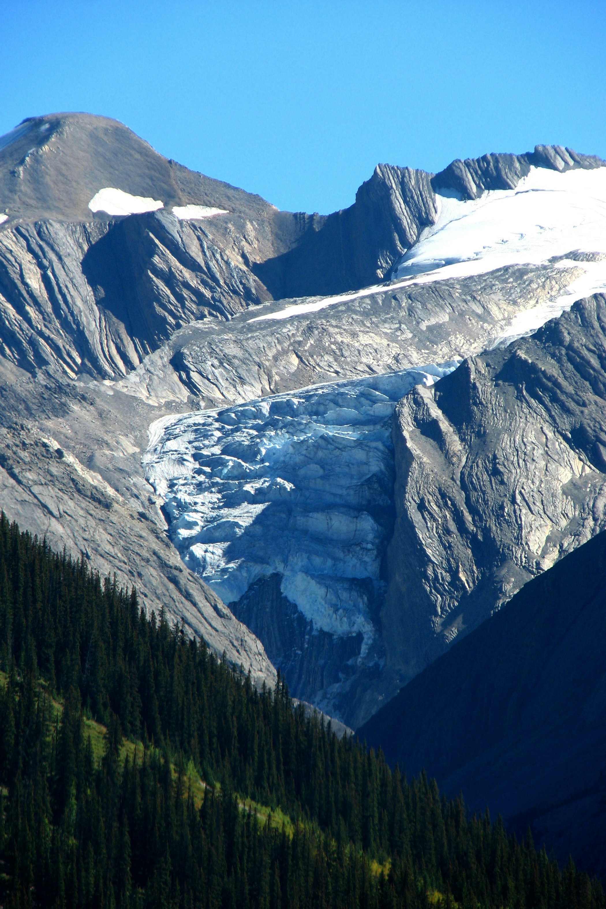 Glacial Cathedral: Striated Peaks guard a blue islet of ice