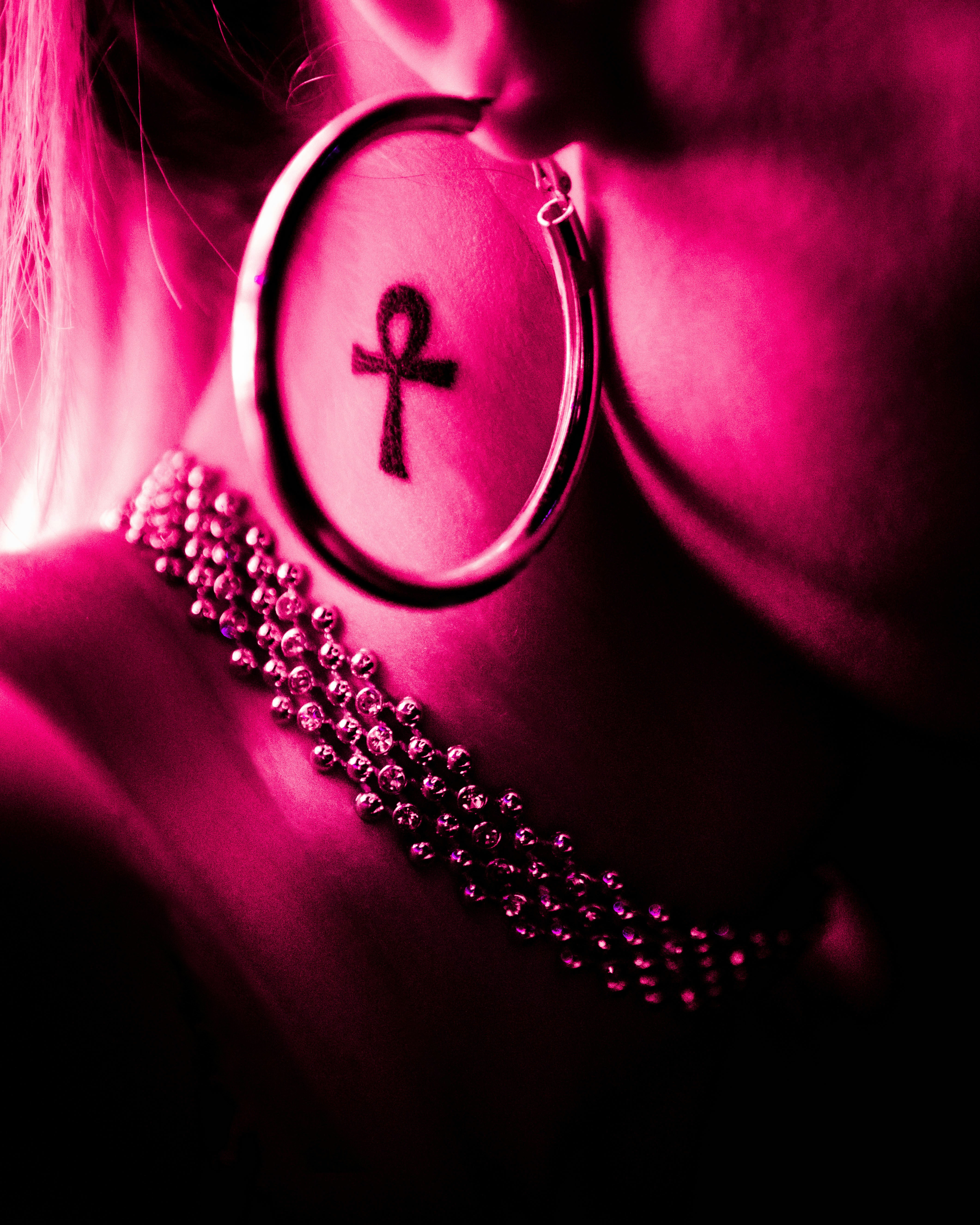 Anker of Identity: An Ankh Charm in Neon Pink Night
