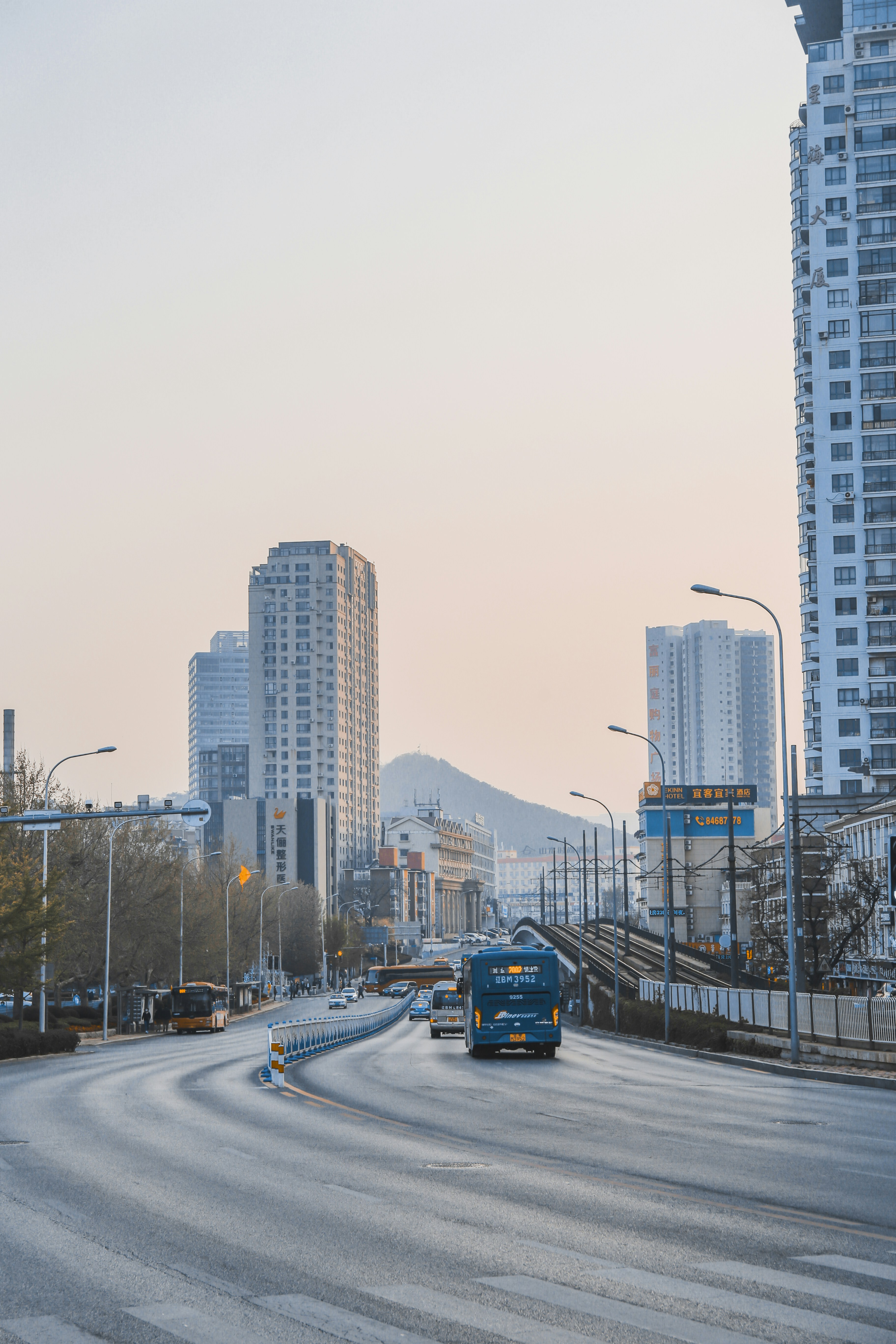 Blue bus on road near city buildings during daytime photo – Free Grey ...