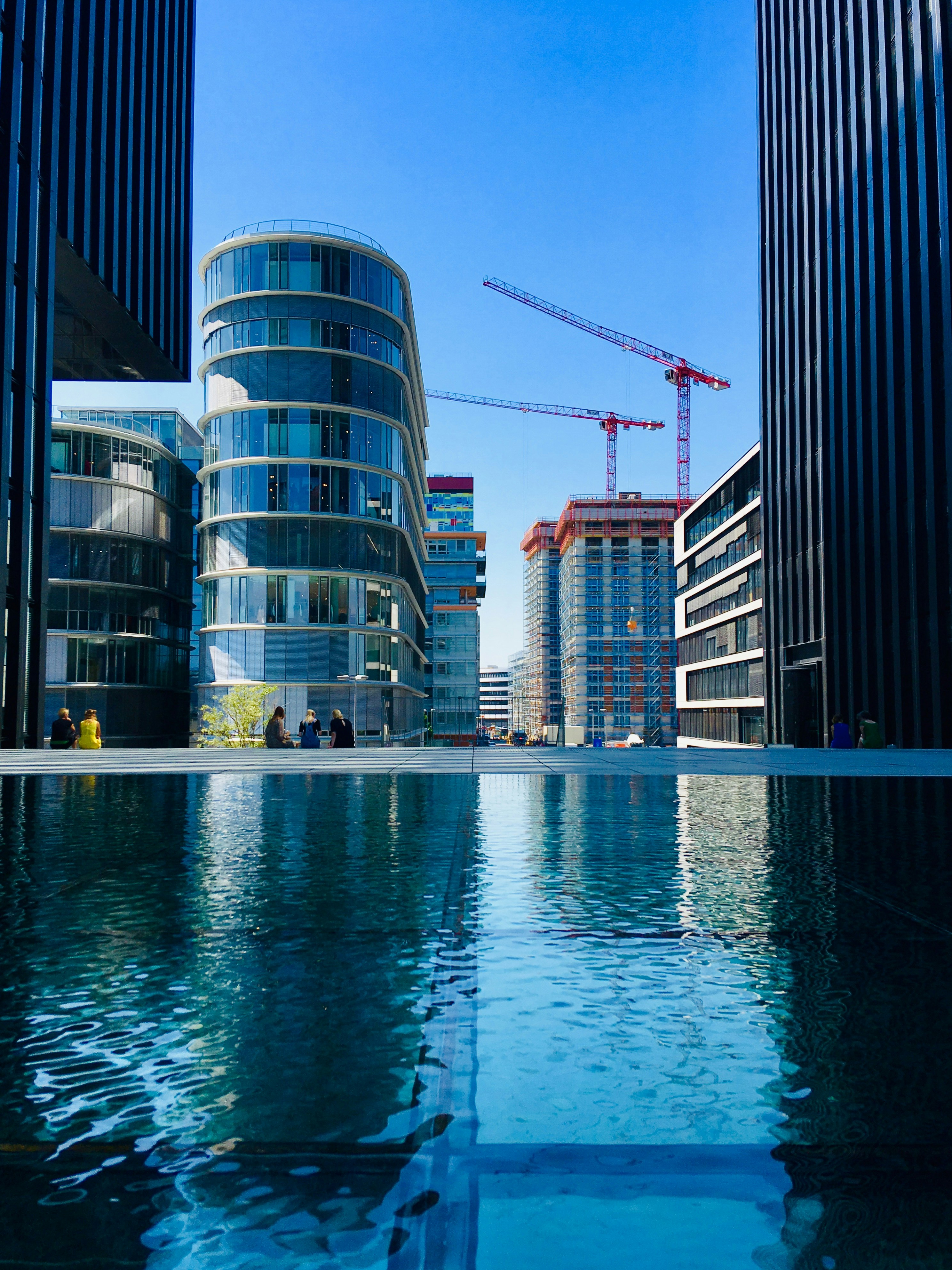 Body of water near high rise buildings during daytime photo – Free ...