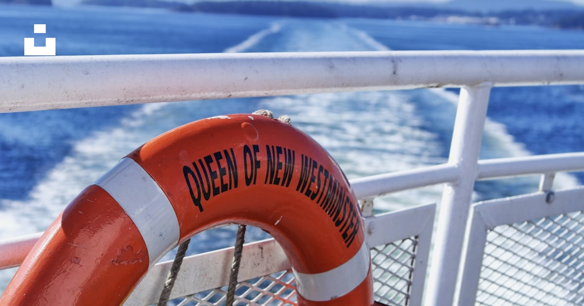 Orange And White Inflatable Buoy On White Metal Railings Photo Free