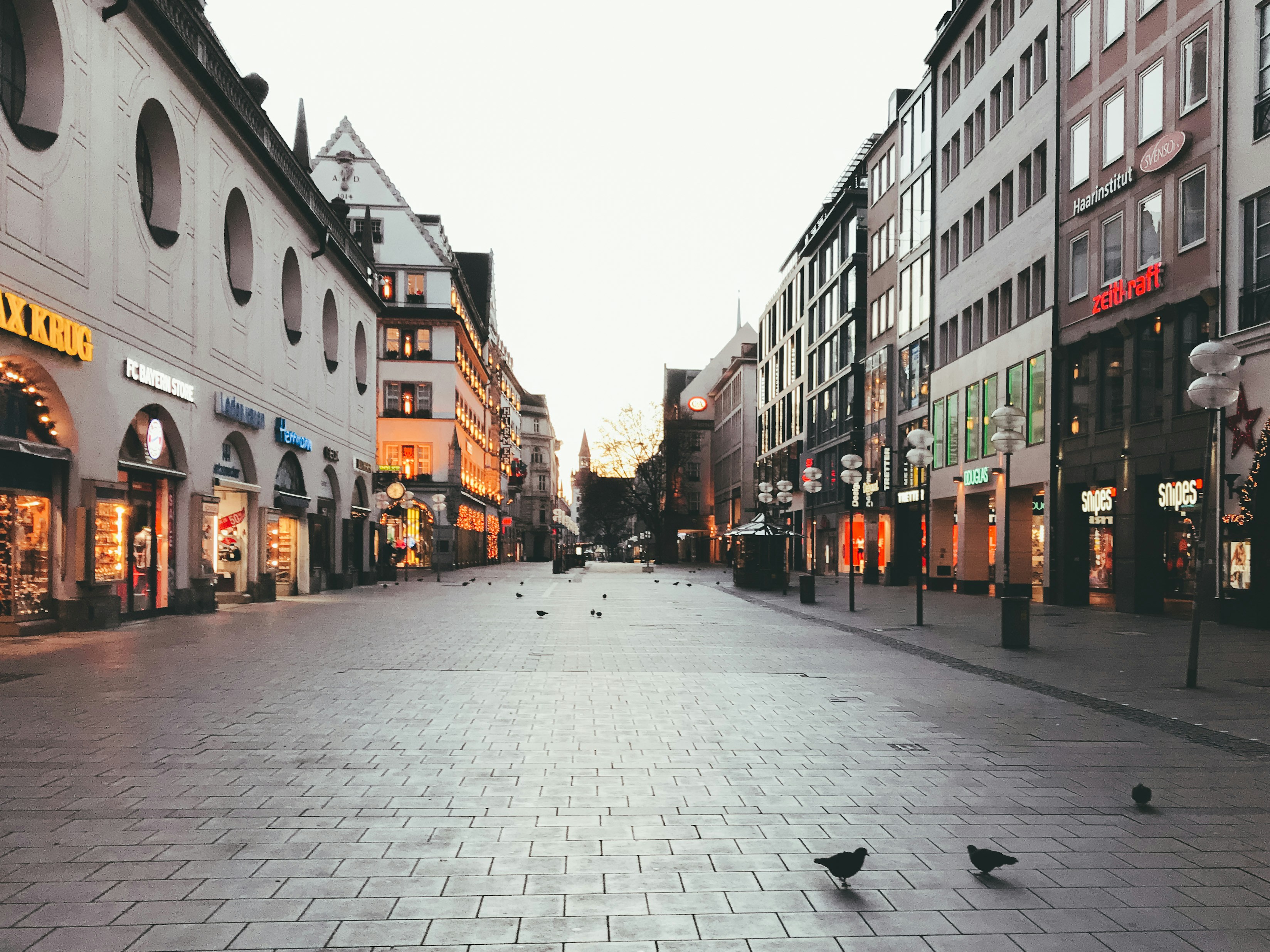 People walking on street between buildings during daytime photo – Free ...