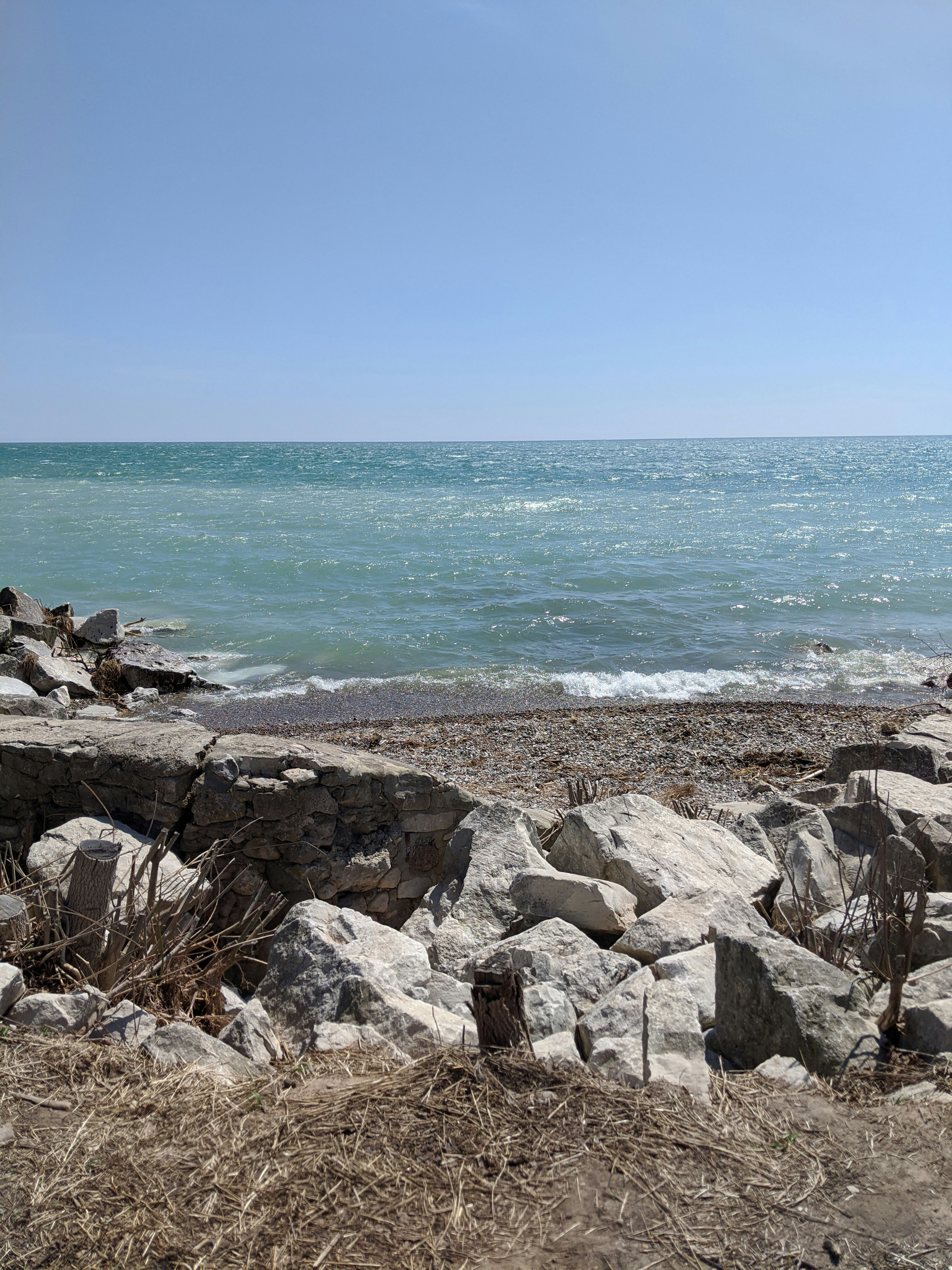 Brown rocks near body of water during daytime photo – Free A happy ...