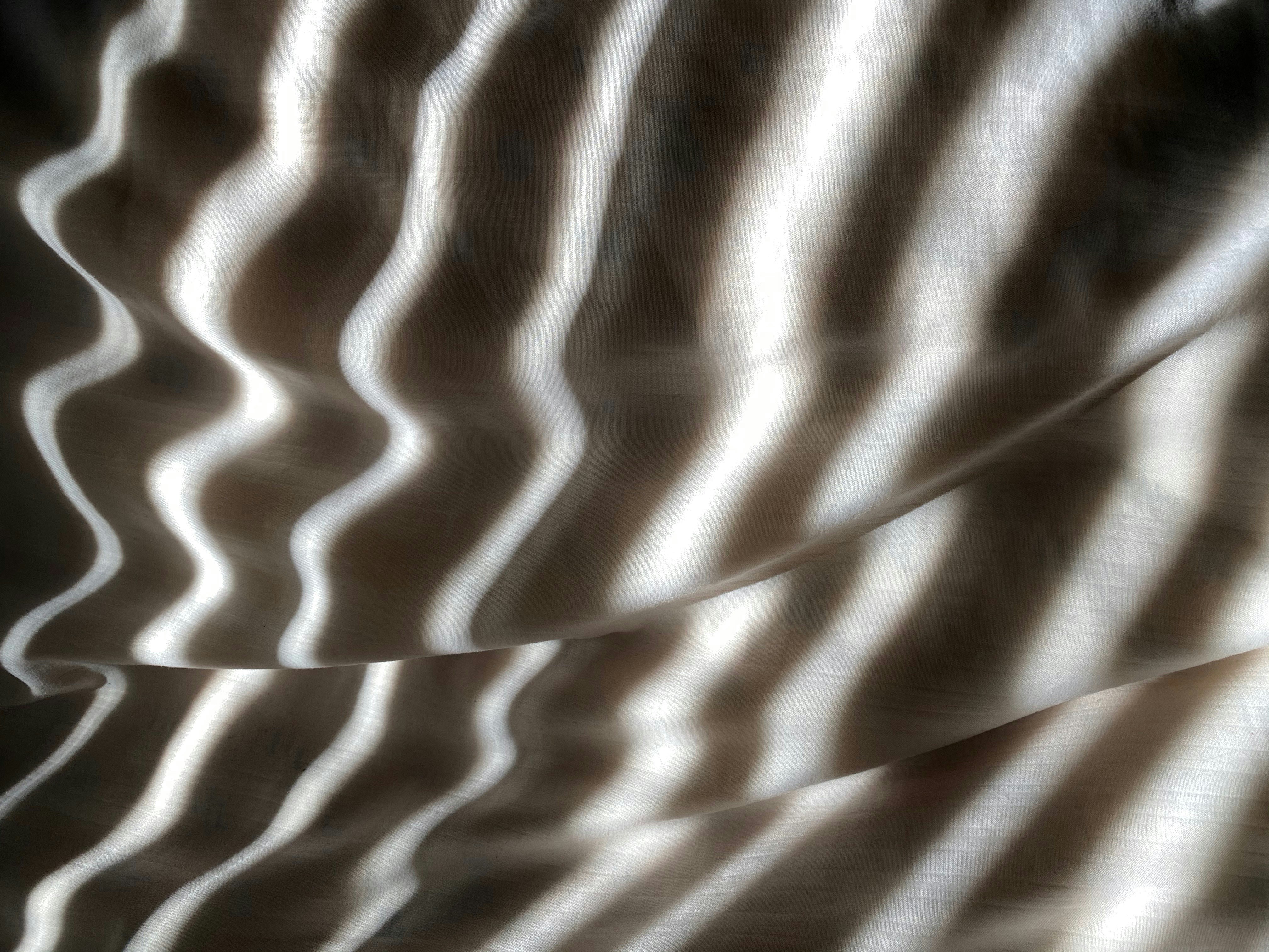 Shadow lines on pillow.  | black and white striped textile