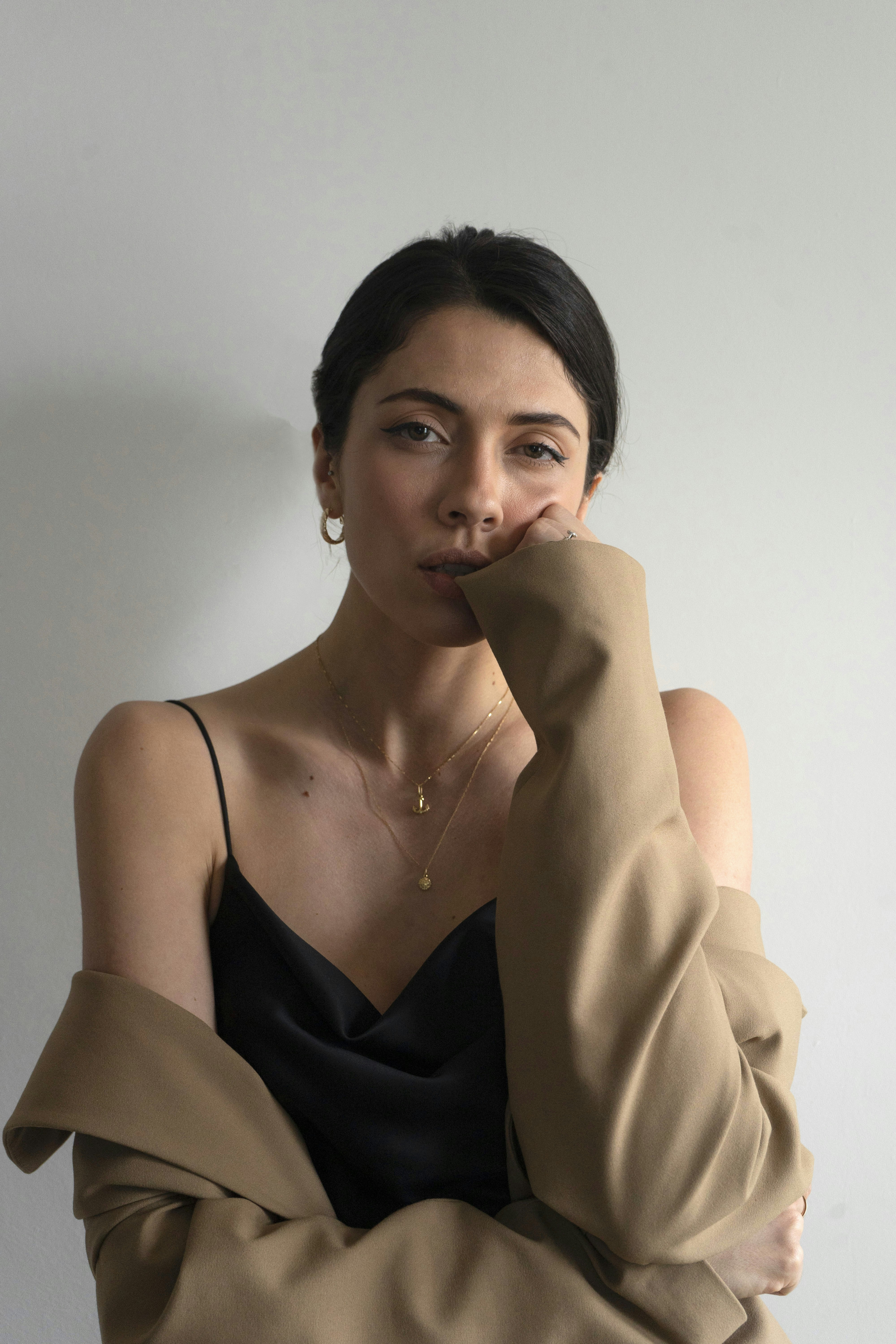 Woman in black spaghetti strap top wearing gold necklace photo – Free ...