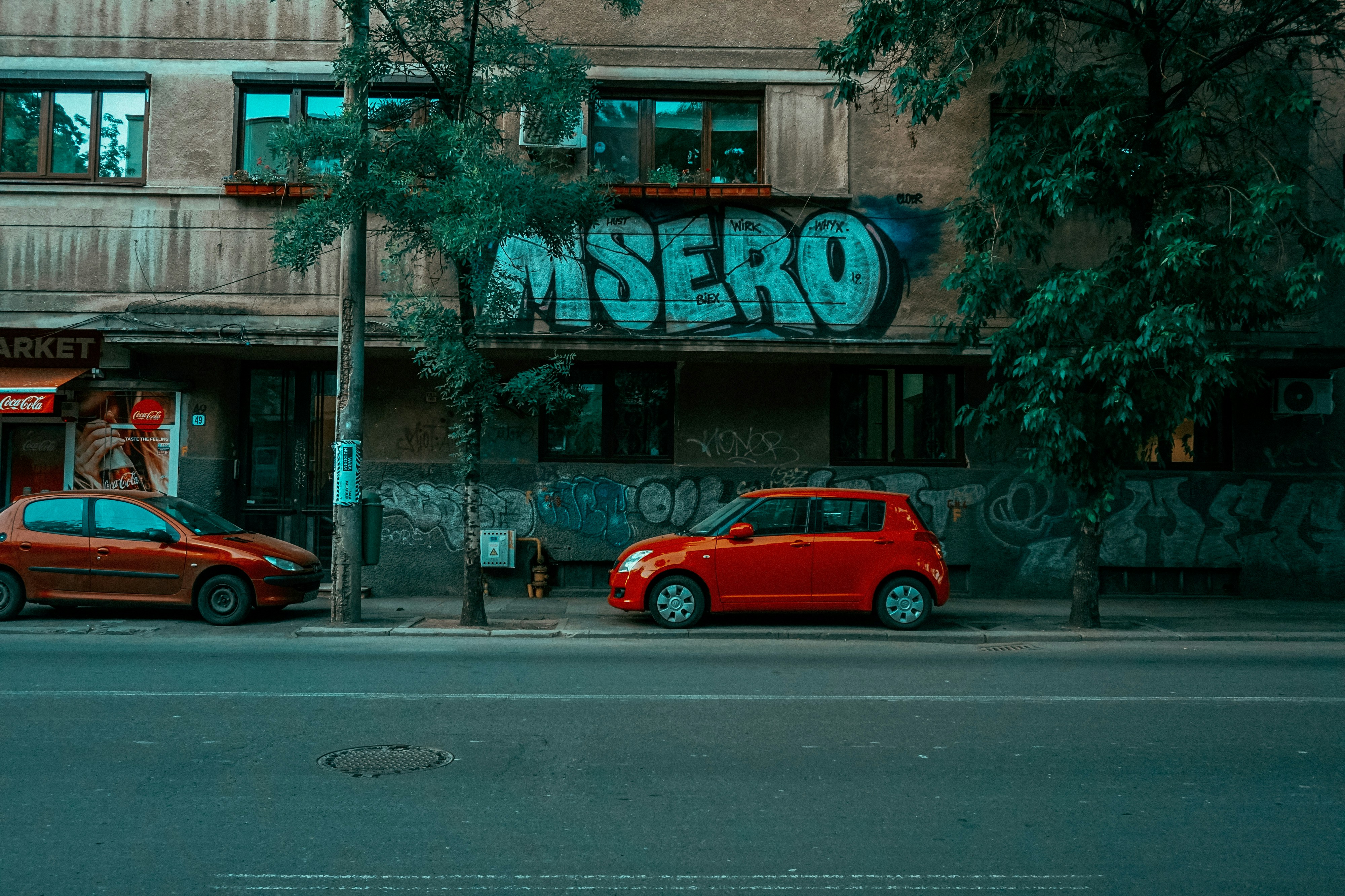 Crimson Microcar by the Graffiti Wall