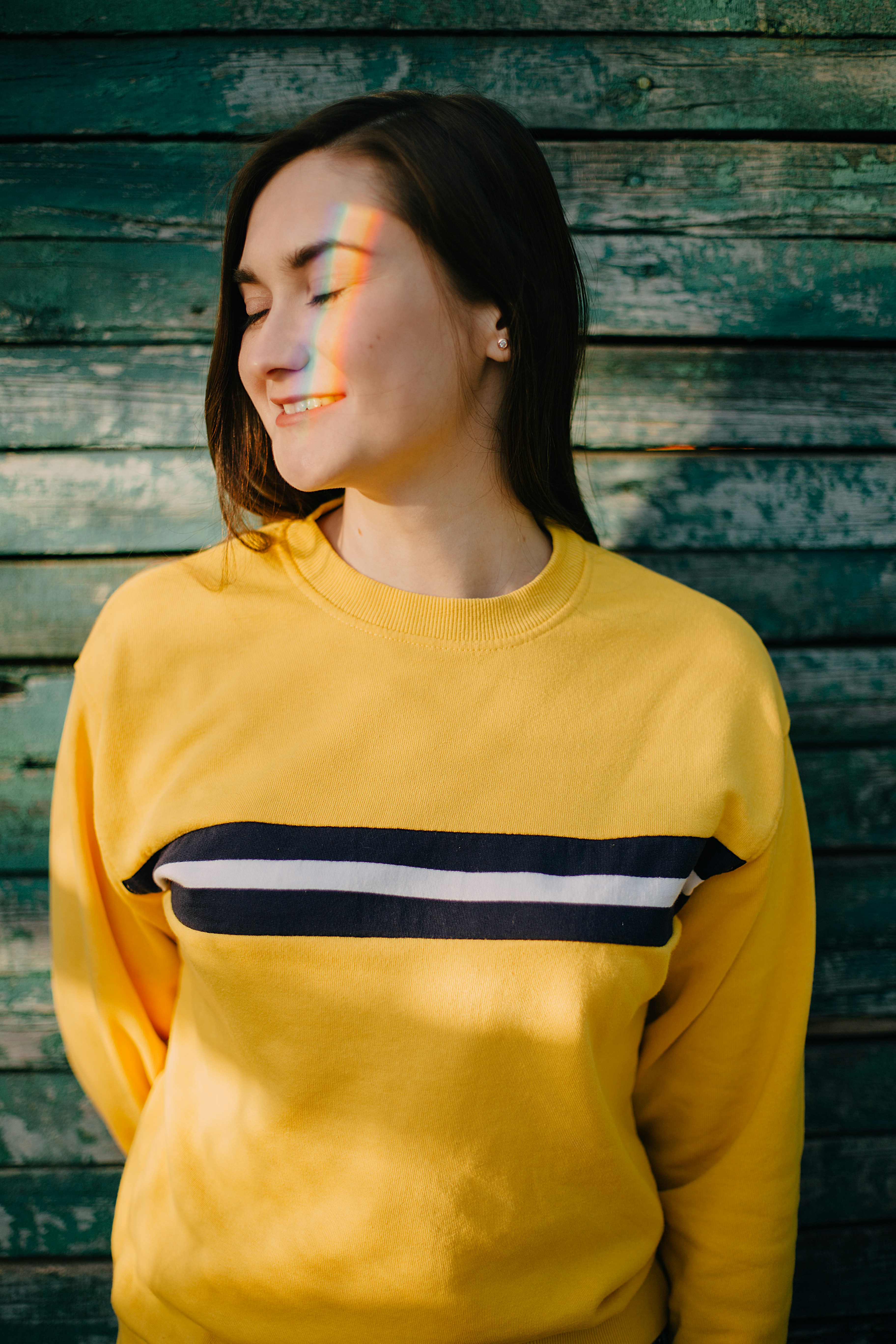 Rainbow Light on Yellow: A Quiet Portrait in Weathered Wood