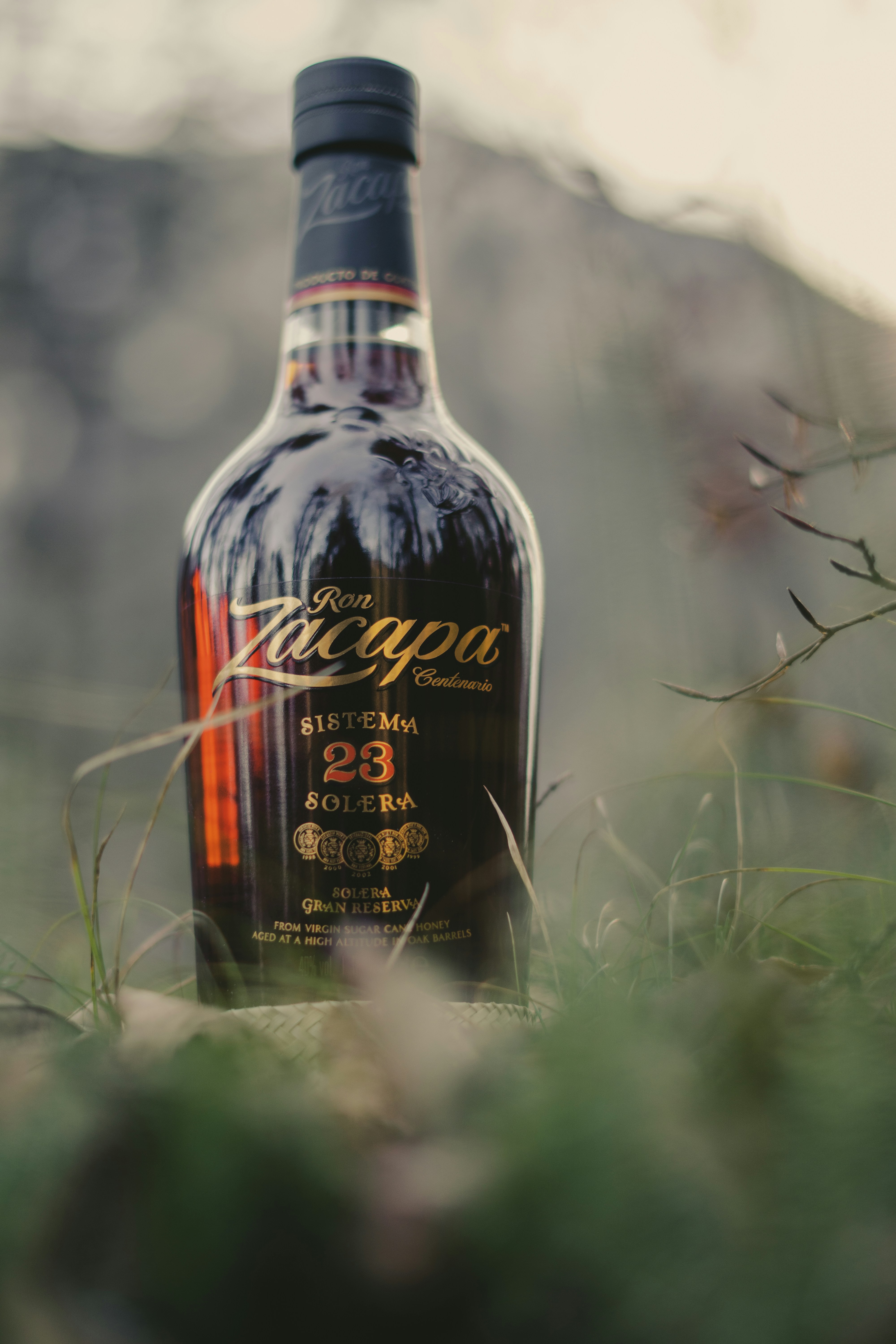 Black and red labeled bottle photo – Free Grey Image on Unsplash