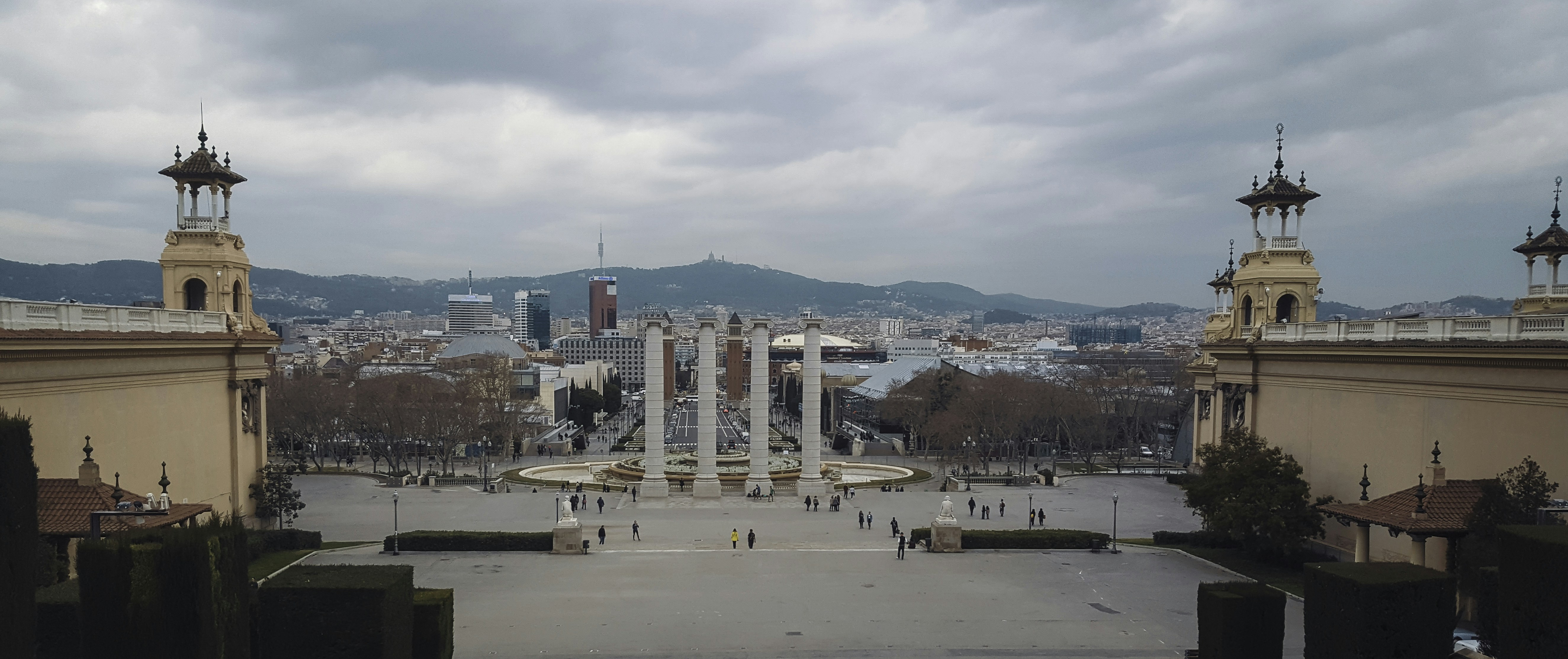 Central Plaza Echoes: A panoramic view toward the distant obelisk-lined square