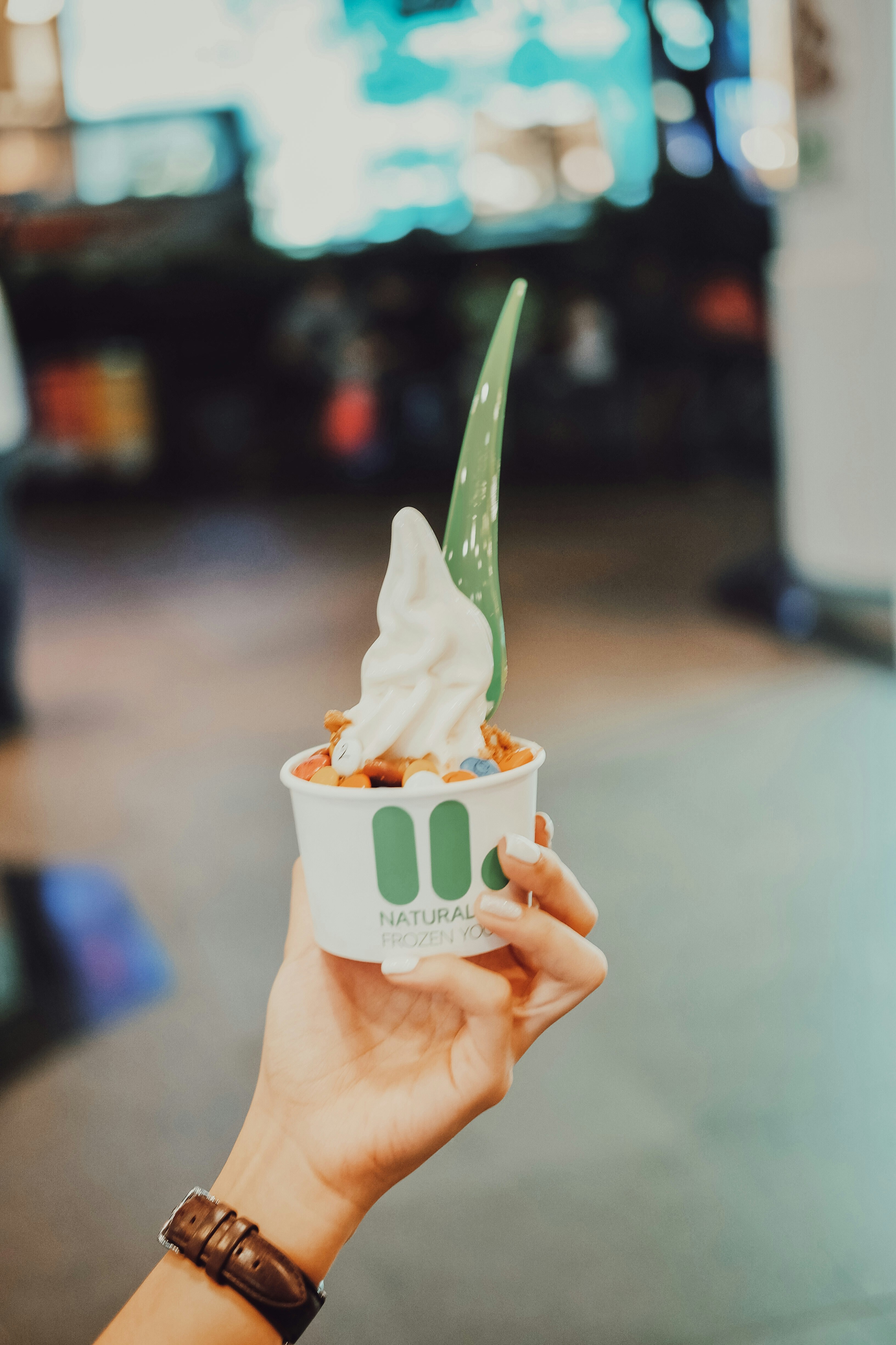 Mint Leaf Crest: A Handheld Ice-Cream Moment in a City Blur