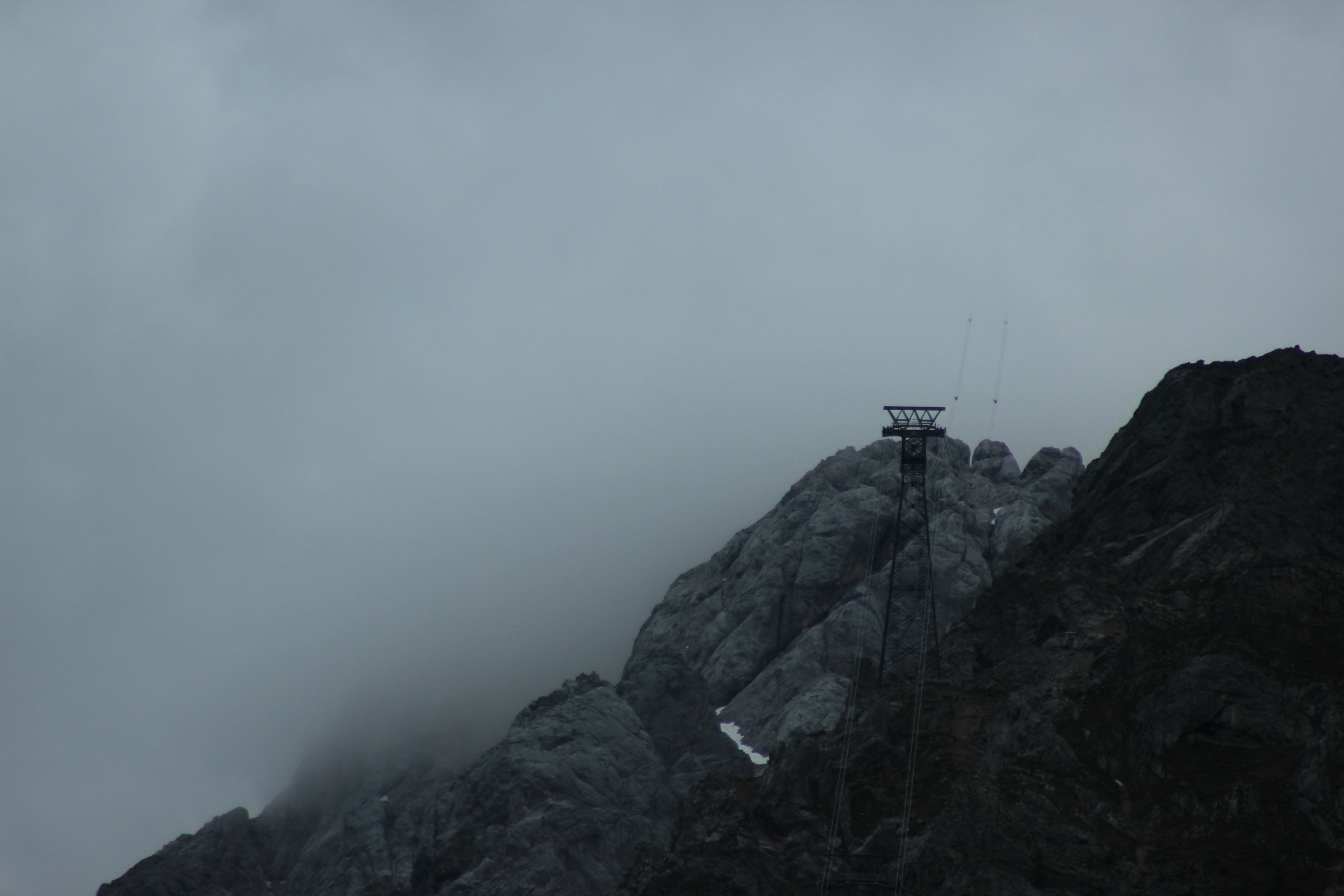 Ridge Sentinel Beneath a Stormy Veil