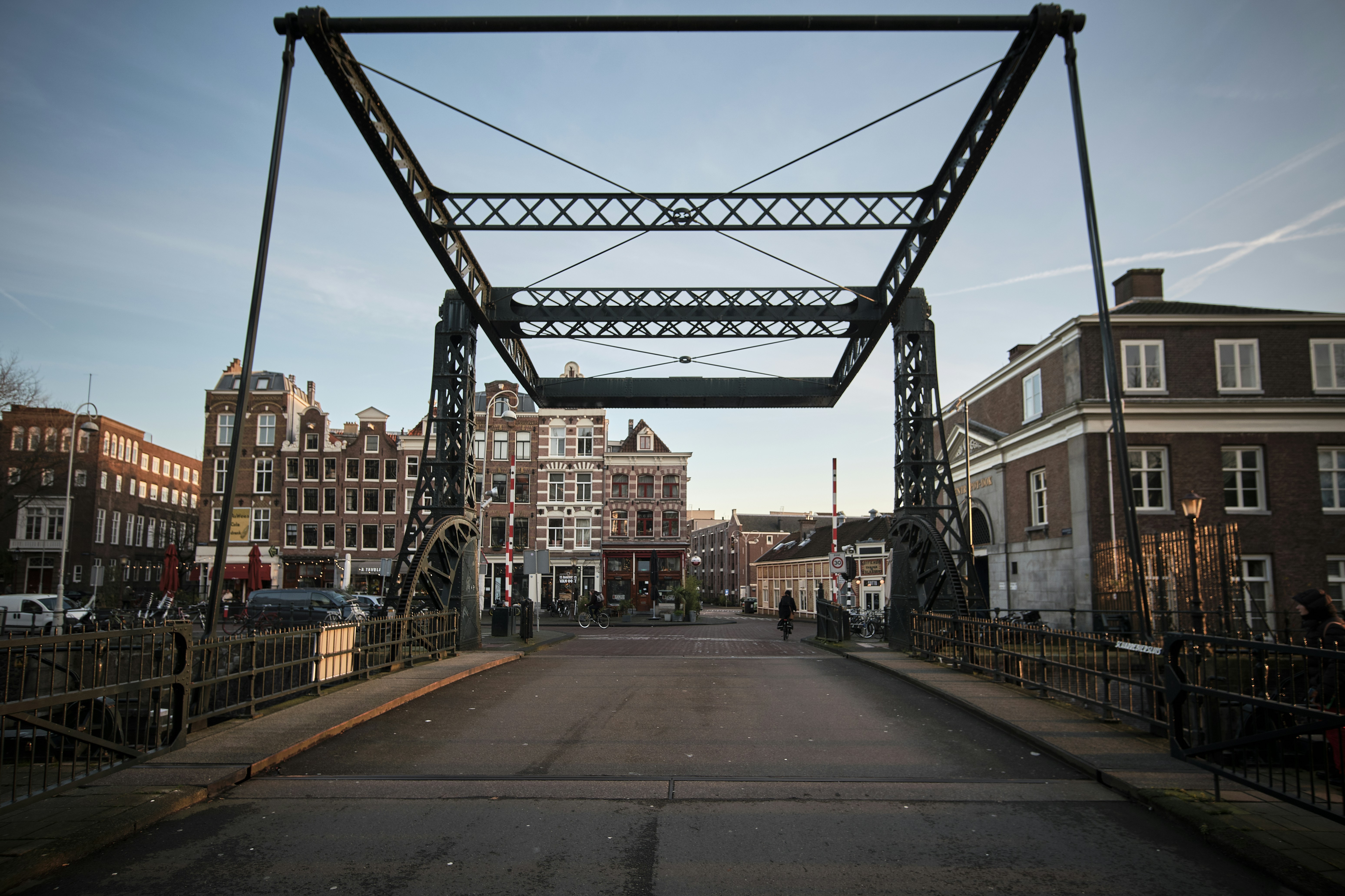 Brown concrete building near bridge during daytime photo – Free City ...