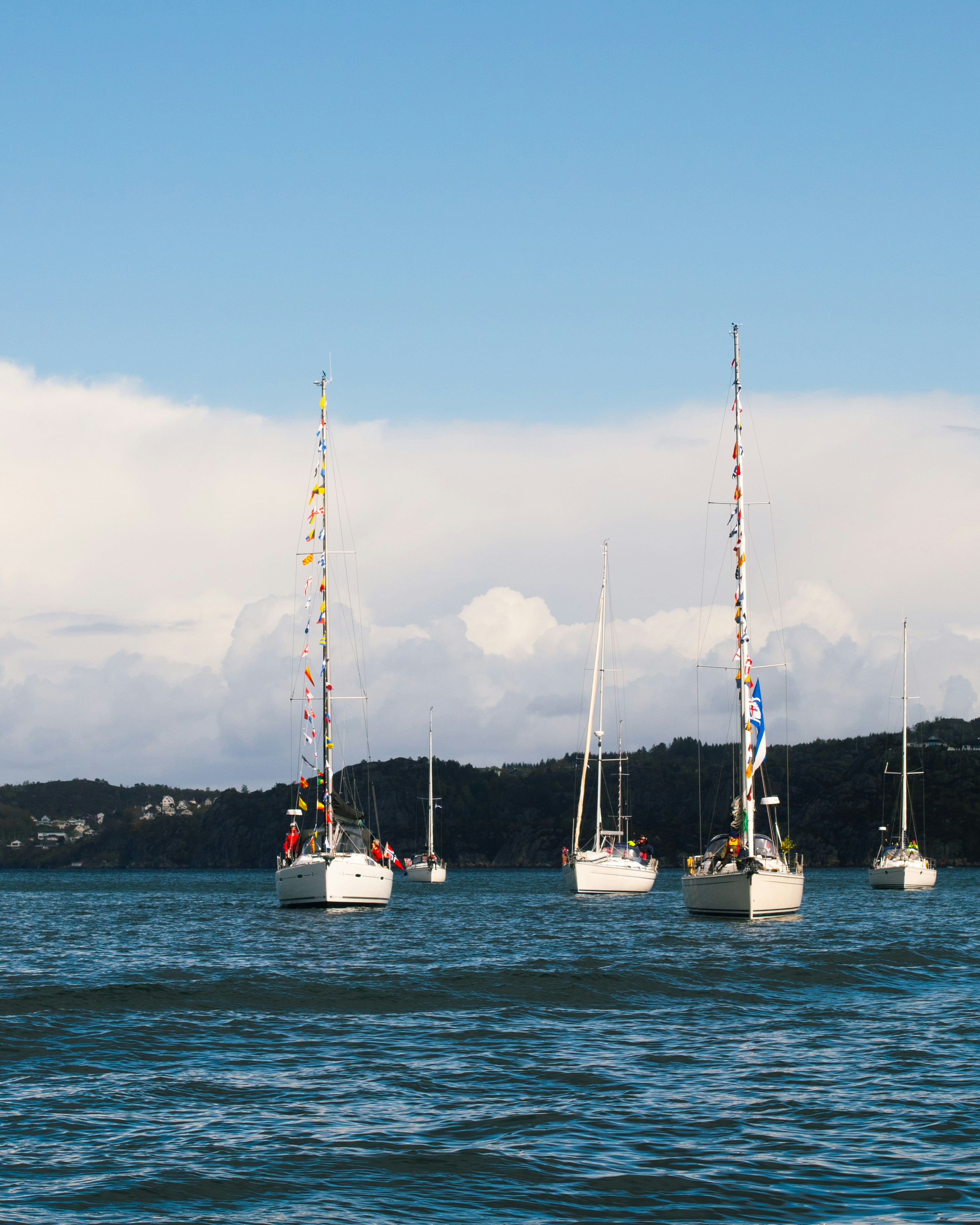 white sail boat on sea during daytime