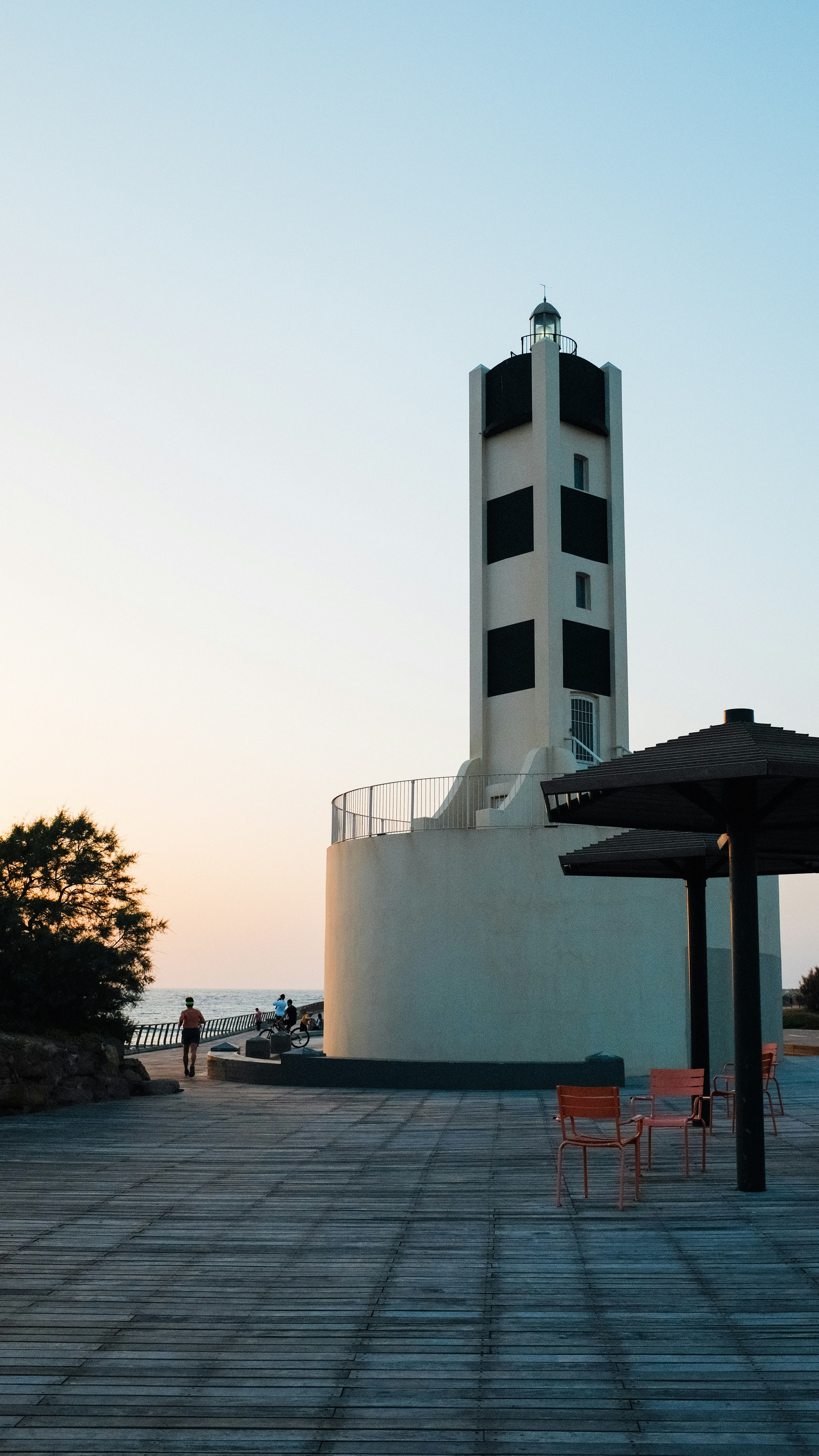Dusk Beacon Over a Modern Seaside Promenade