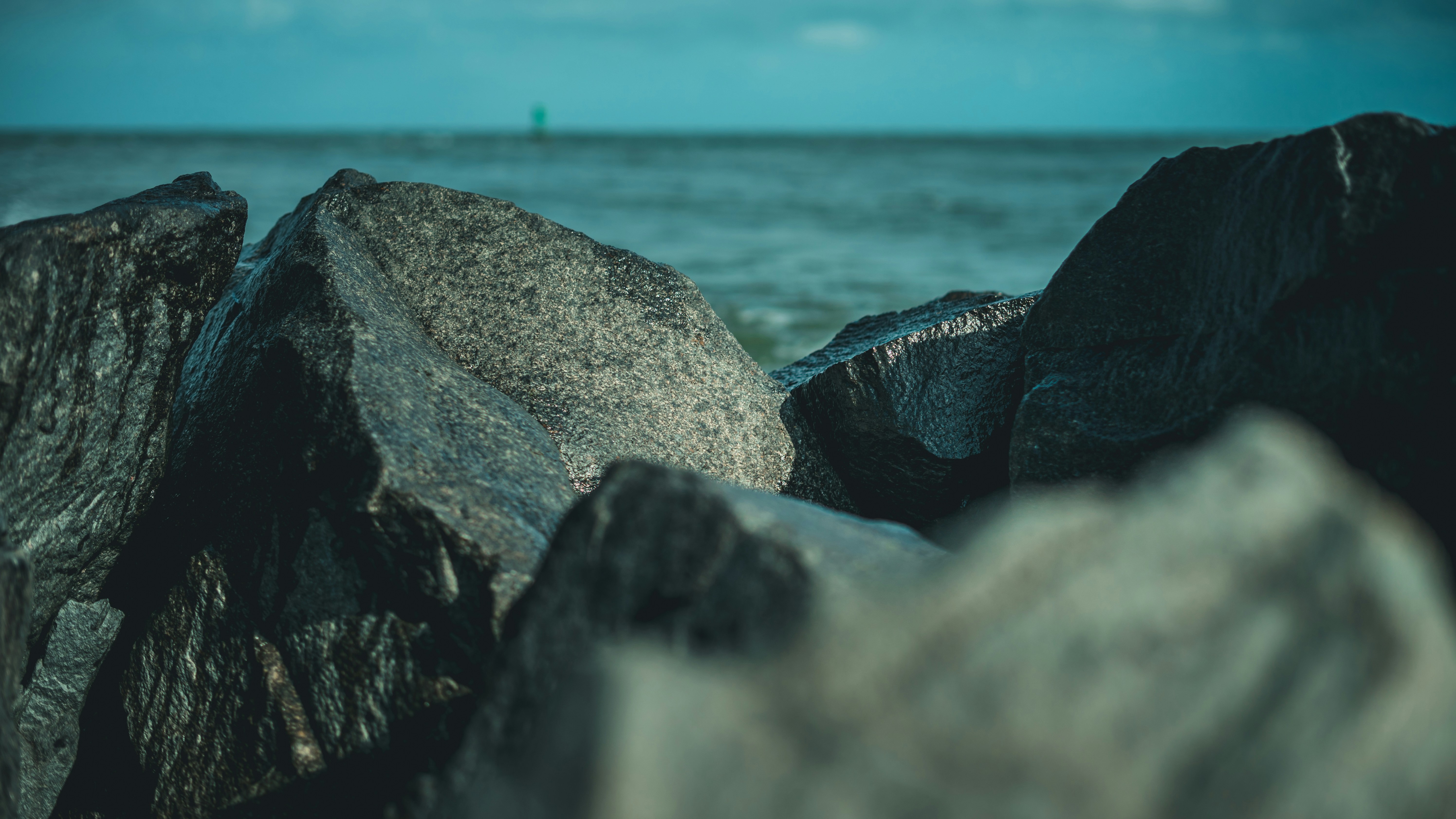 Gray and black rock near body of water during daytime photo – Free ...
