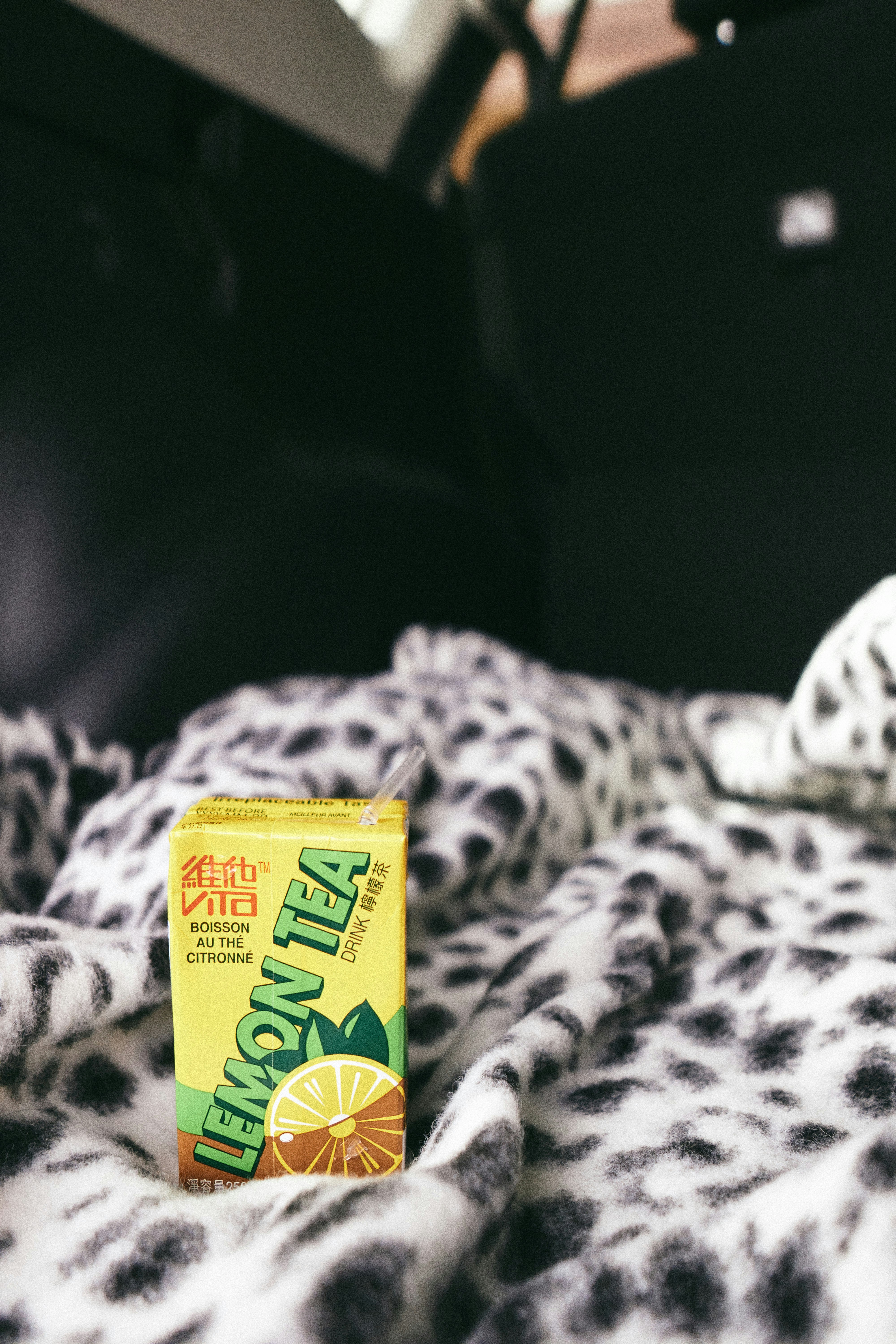 Citrus Capsule on Leopard Plush: A Quiet Still Life