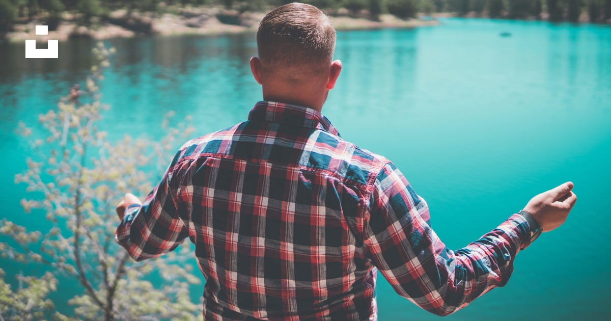 Man In Red Black And White Plaid Dress Shirt Standing Near Body Of