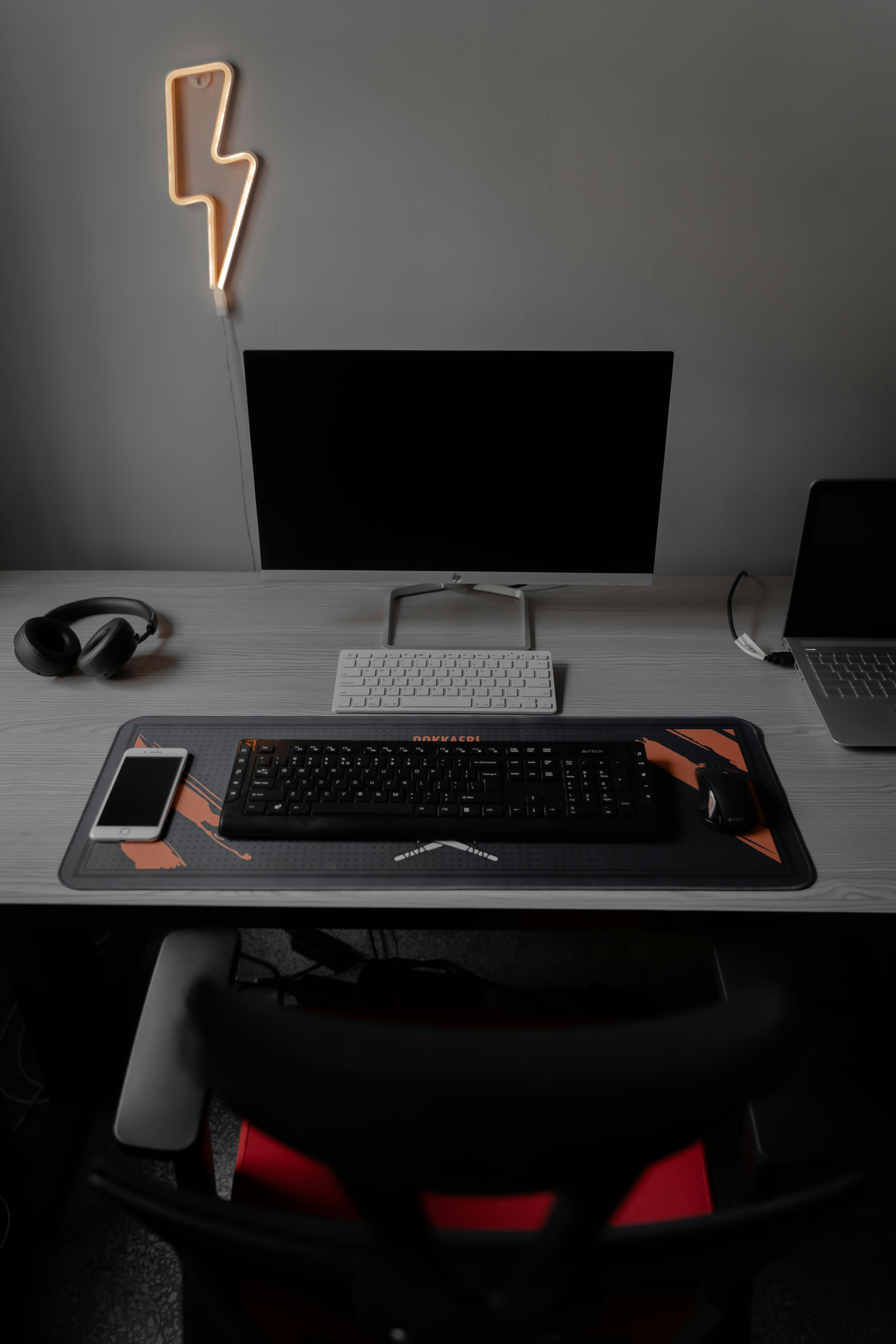 Neon Bolt Above a Minimalist Tech Desk