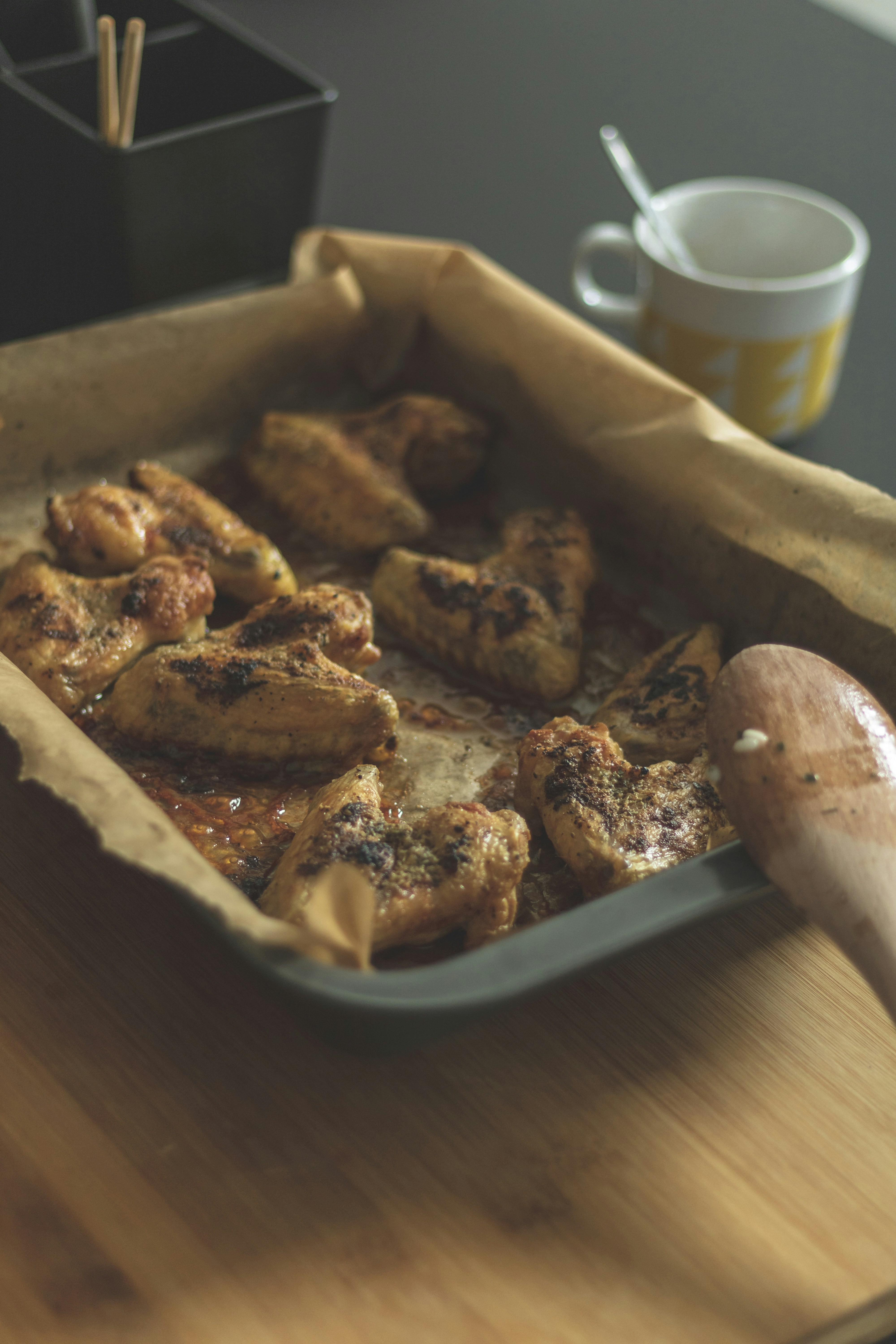 Golden Wings on Parchment: A Rustic Kitchen Still Life