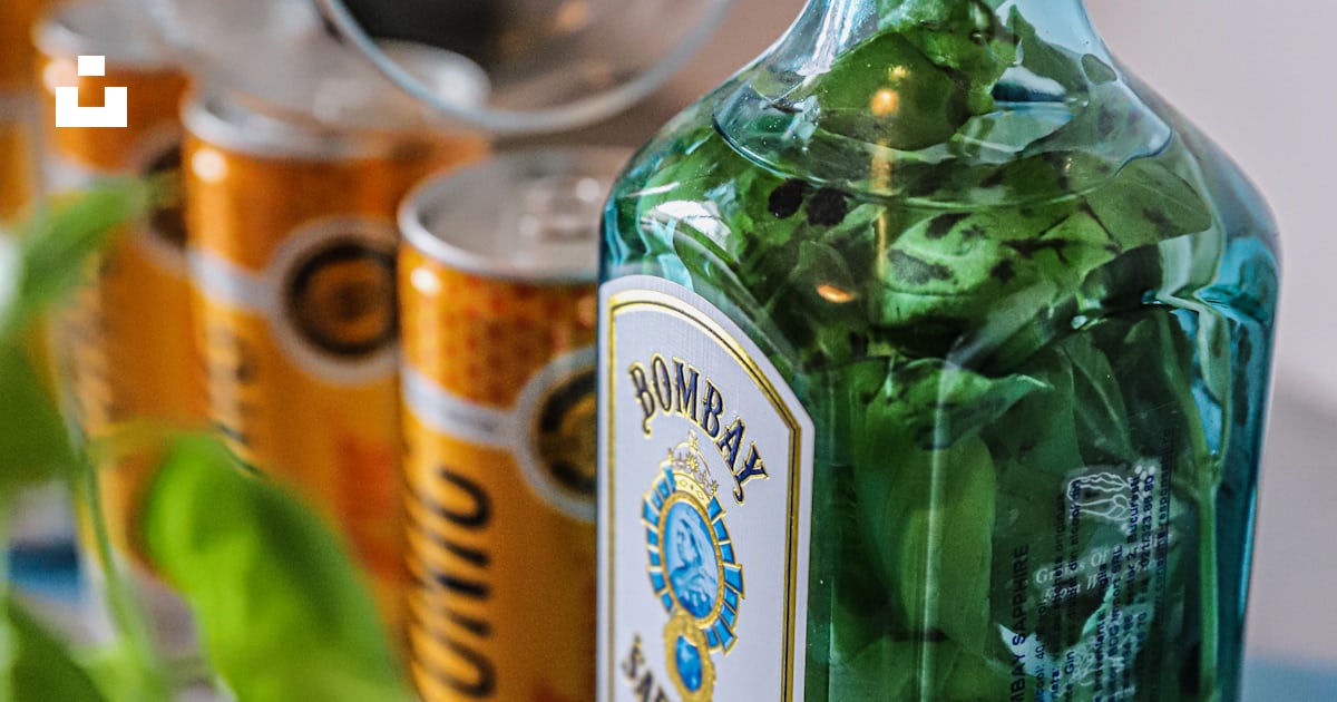 Green Glass Bottle Beside Clear Glass Bottle Photo Free Beverage