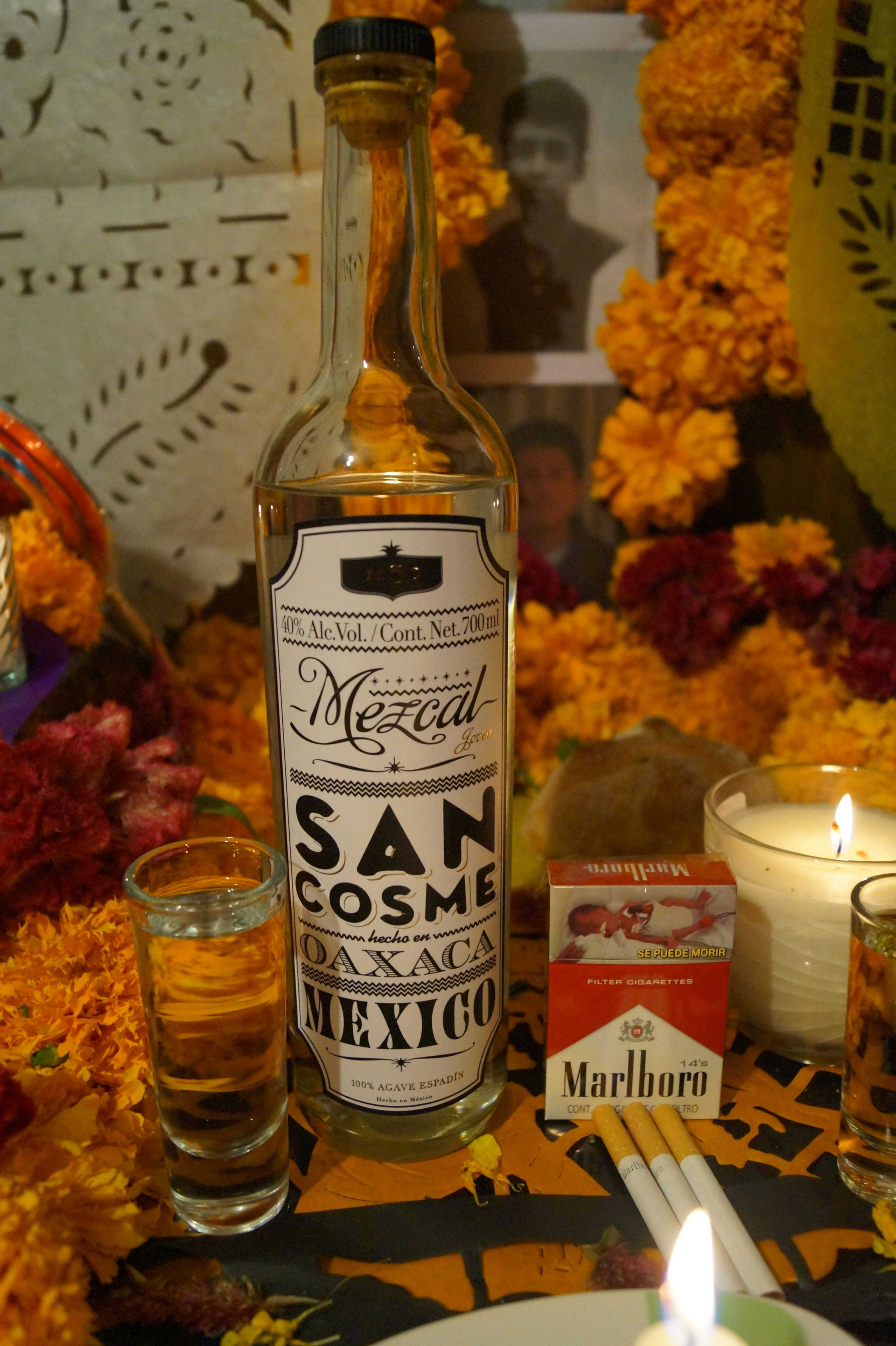 Bottle of Mezcal at a Day of the Dead Altar