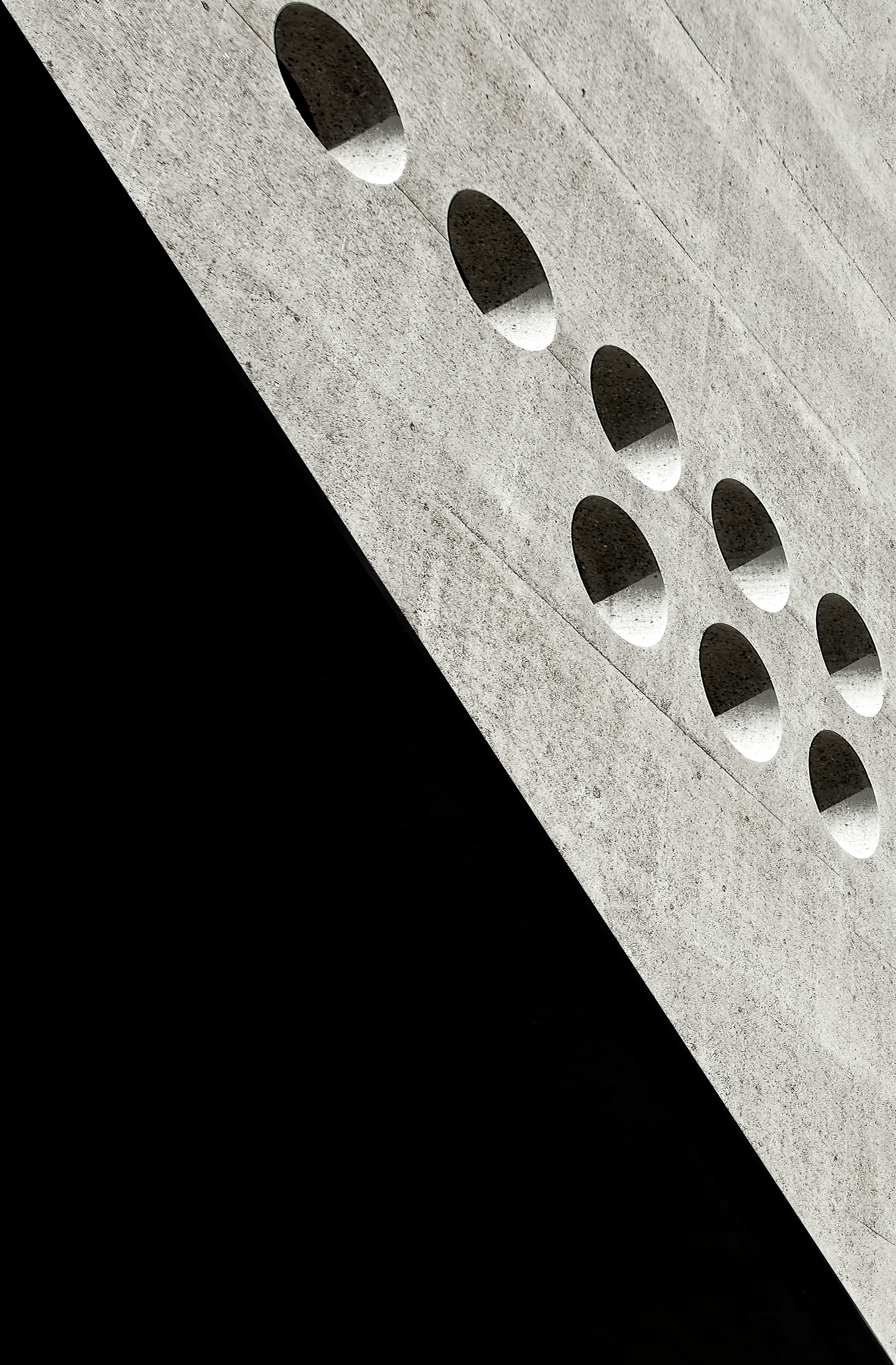 A concrete structure with holes in the middle of it photo – Free ...