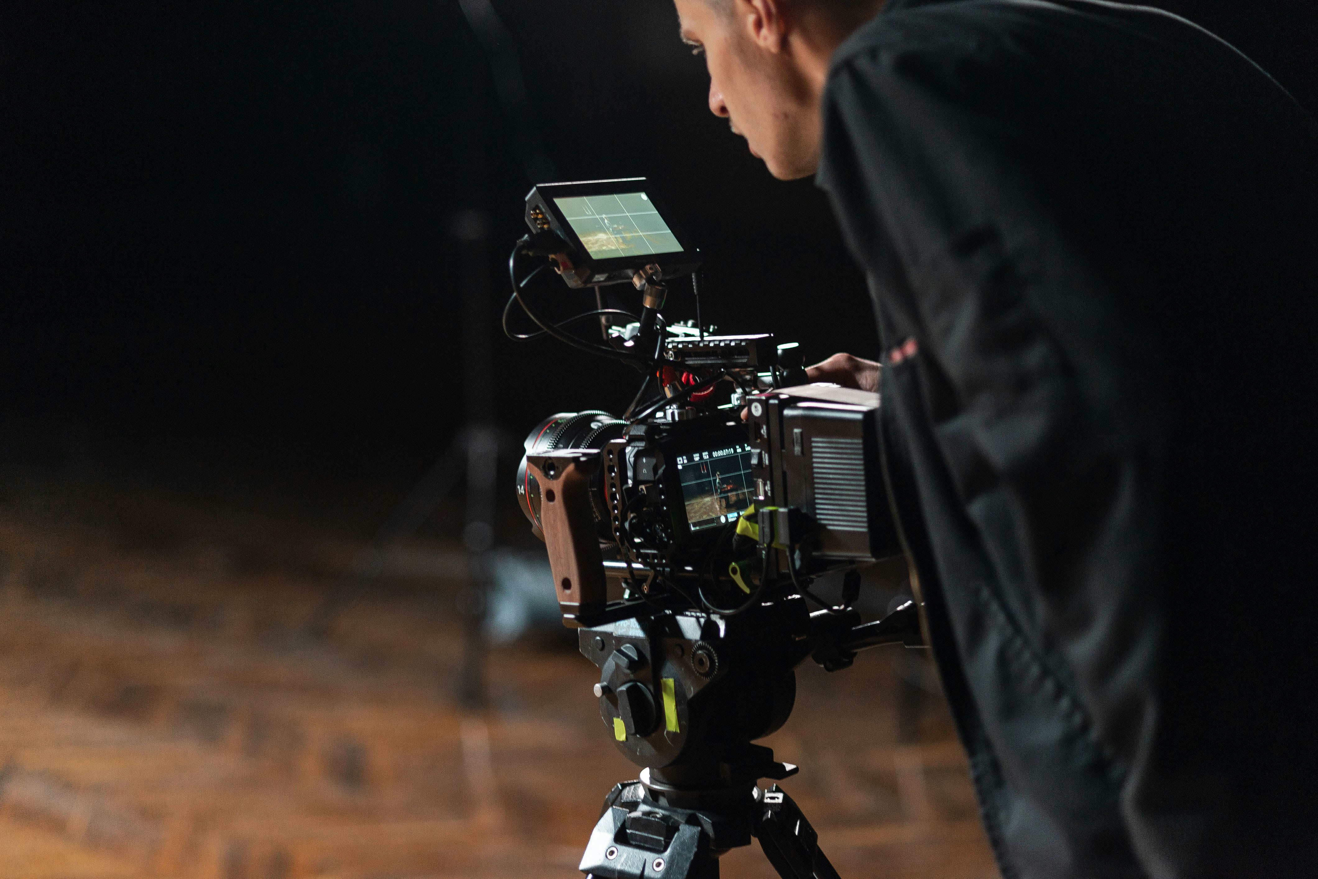 Man in black suit jacket using video camera photo – Free Human Image on ...