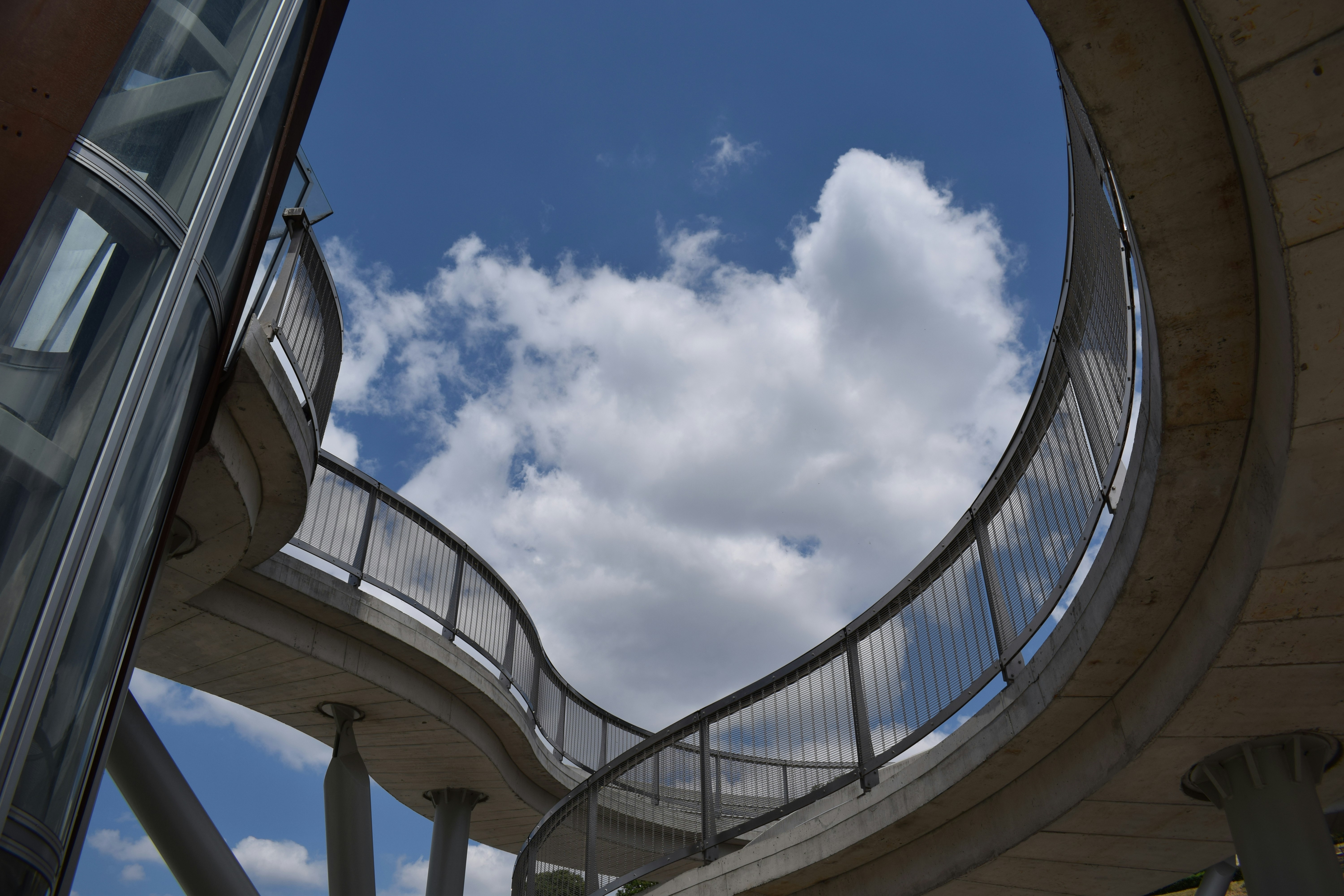 Circling Sky: A Concrete Spiral Framing an Open Blue Landscape