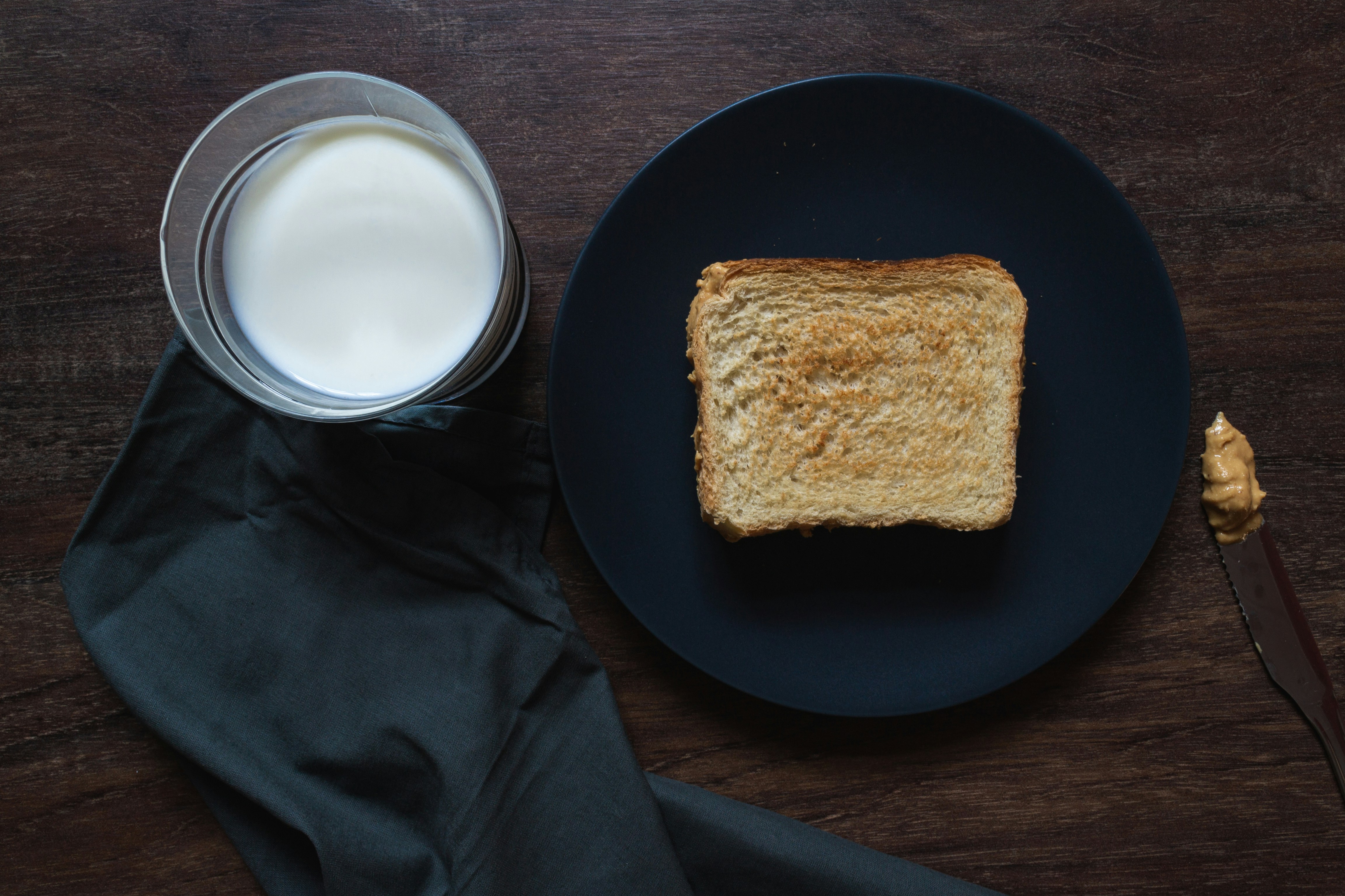 Muted Morning Toast: A Minimal Still Life with Milk and Butter Knife